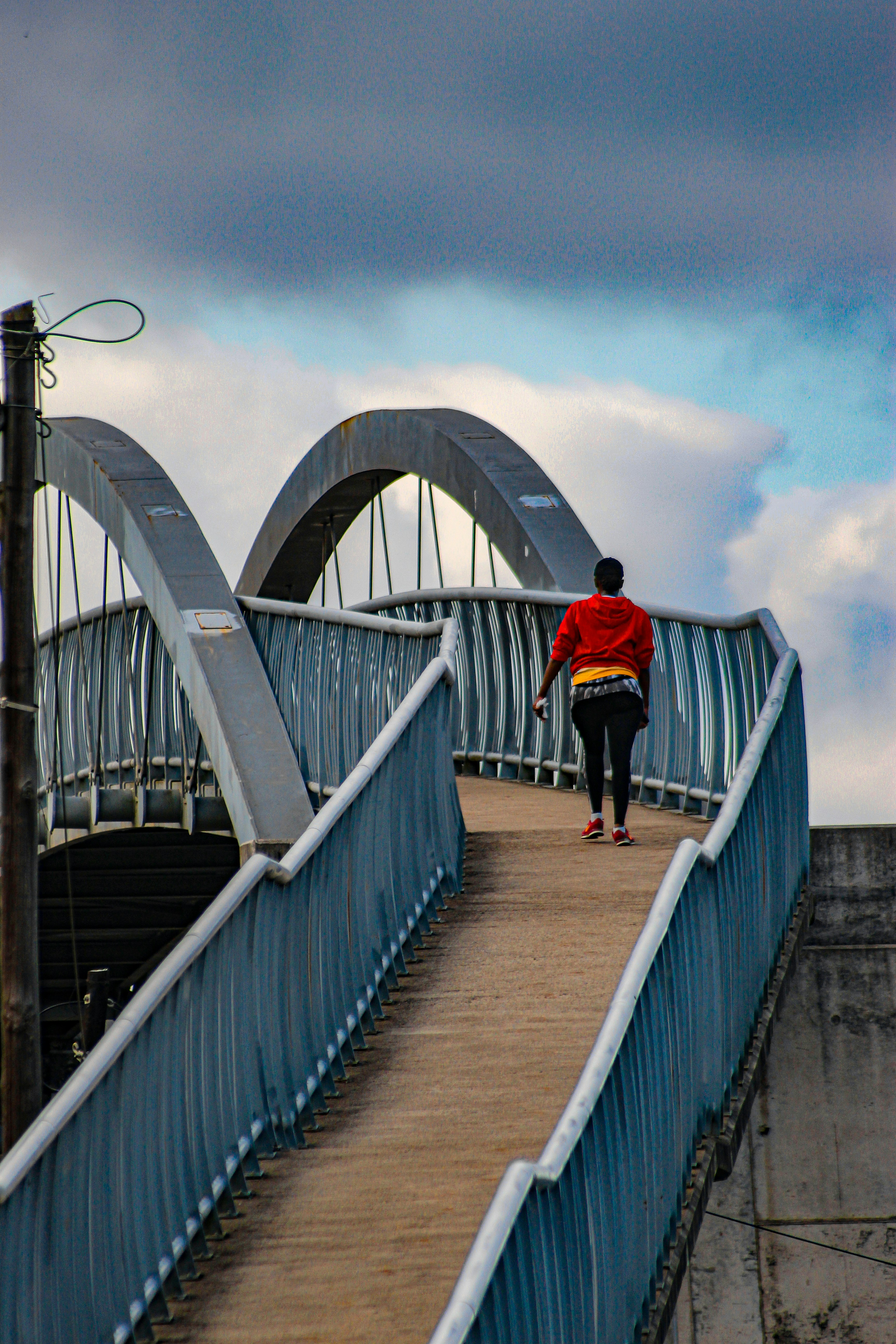 Runner on a Curved Bridge: A Journey Across Steel Arches