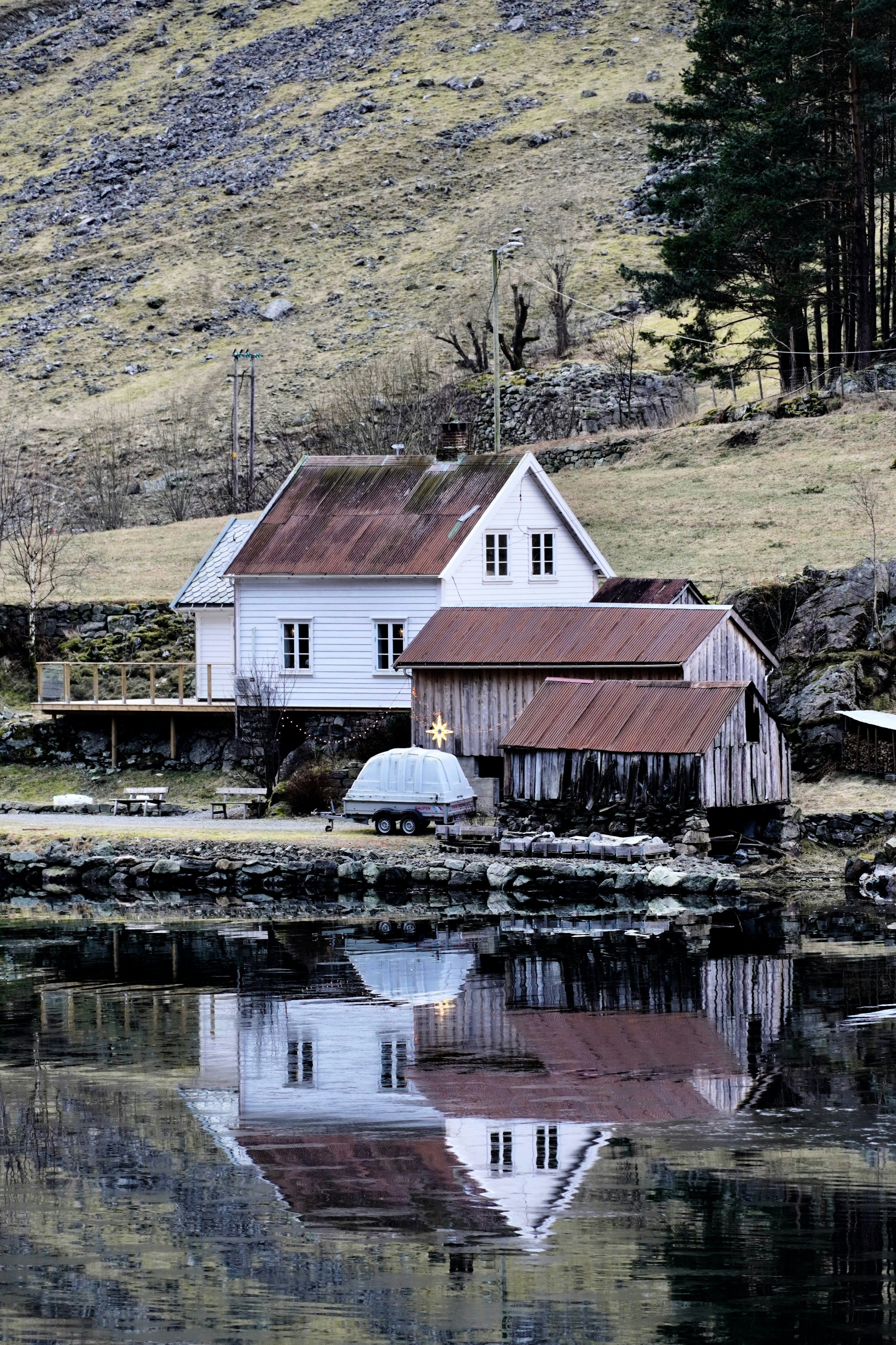 Charming riverside homestead and its mirrored gables