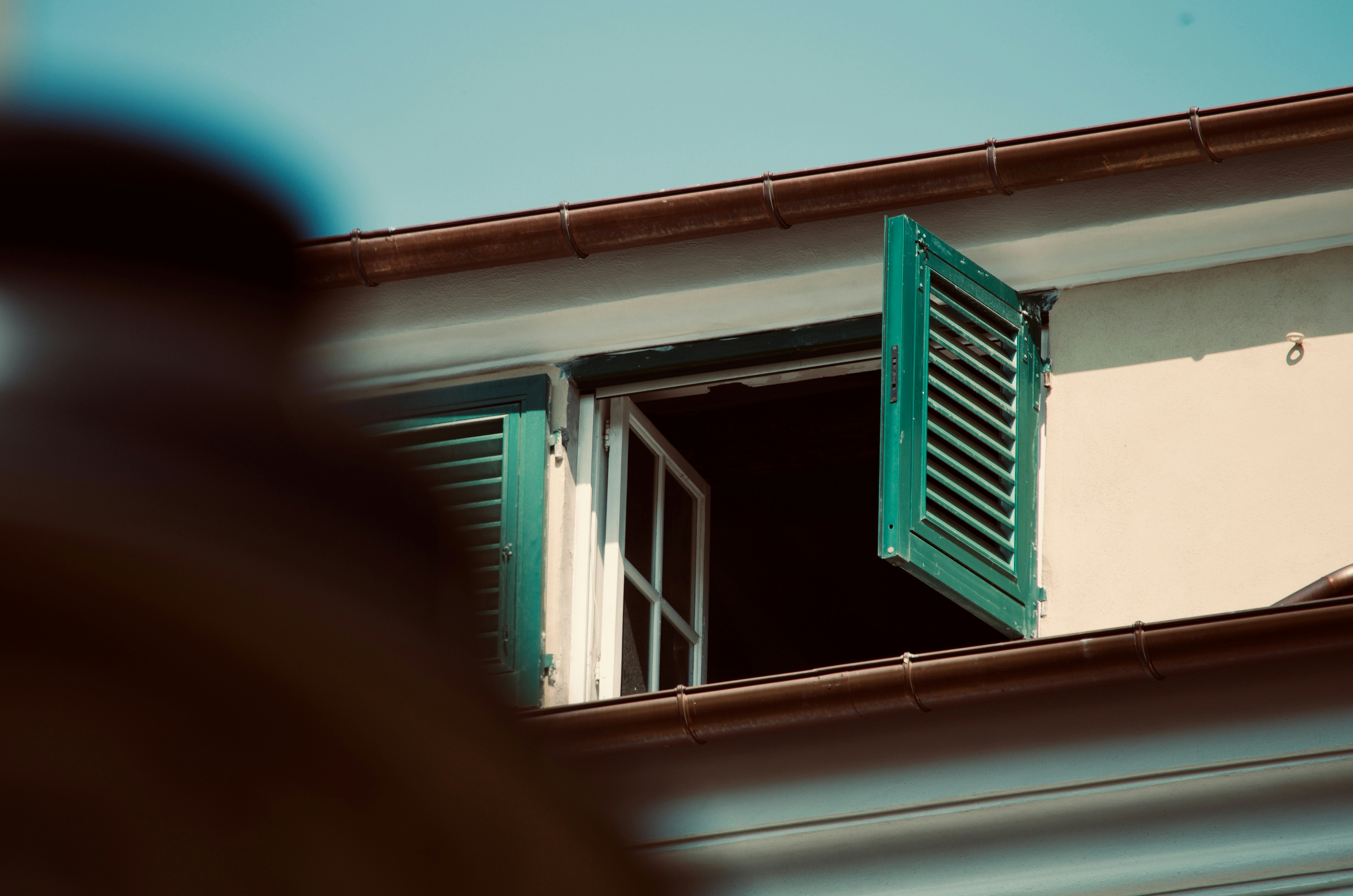 Open Shutter, Green Window: A Quiet Moment in an Old House