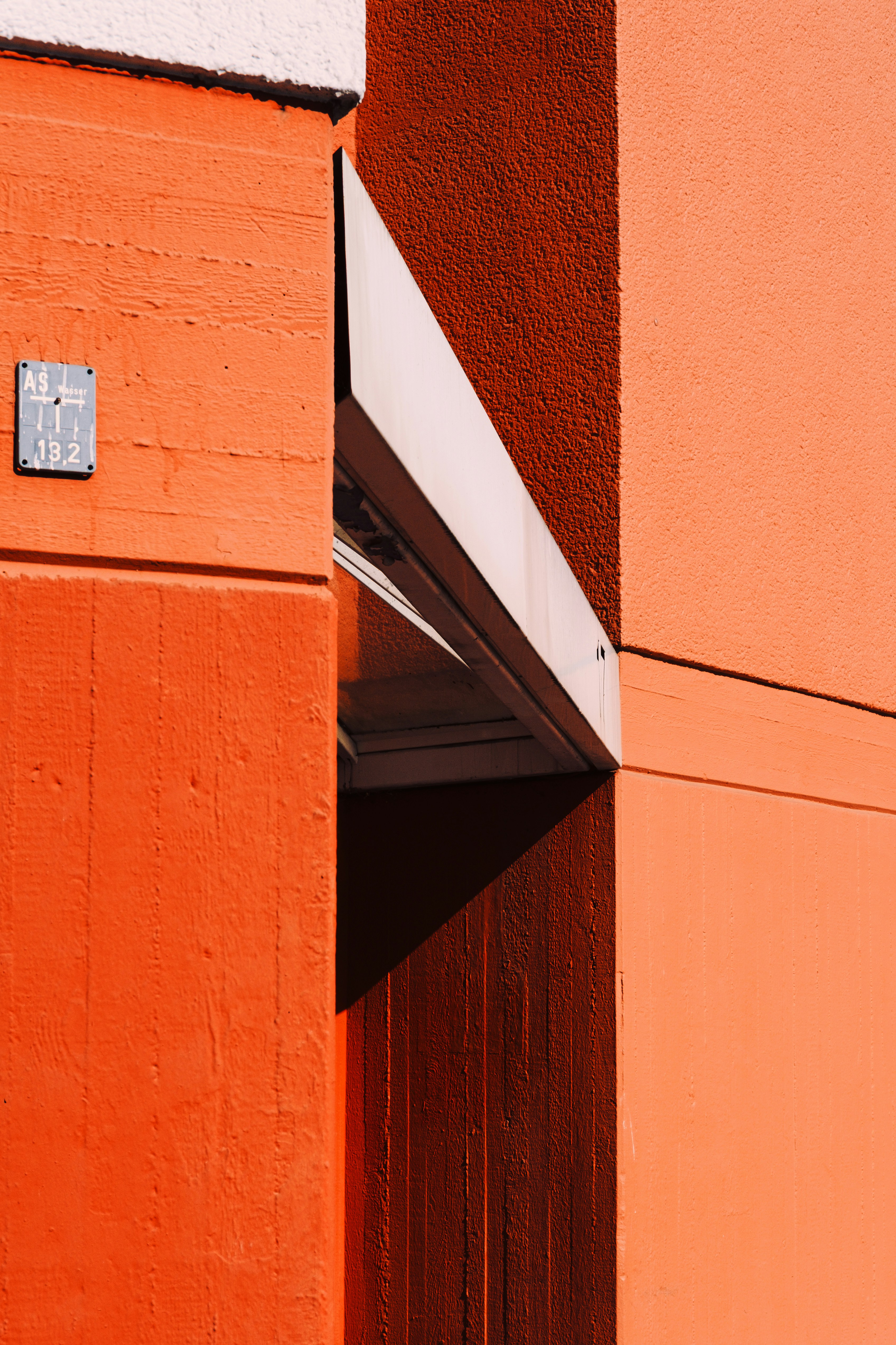 Almond Concrete Angles: A Bold Juxtaposition of Color and Shadow