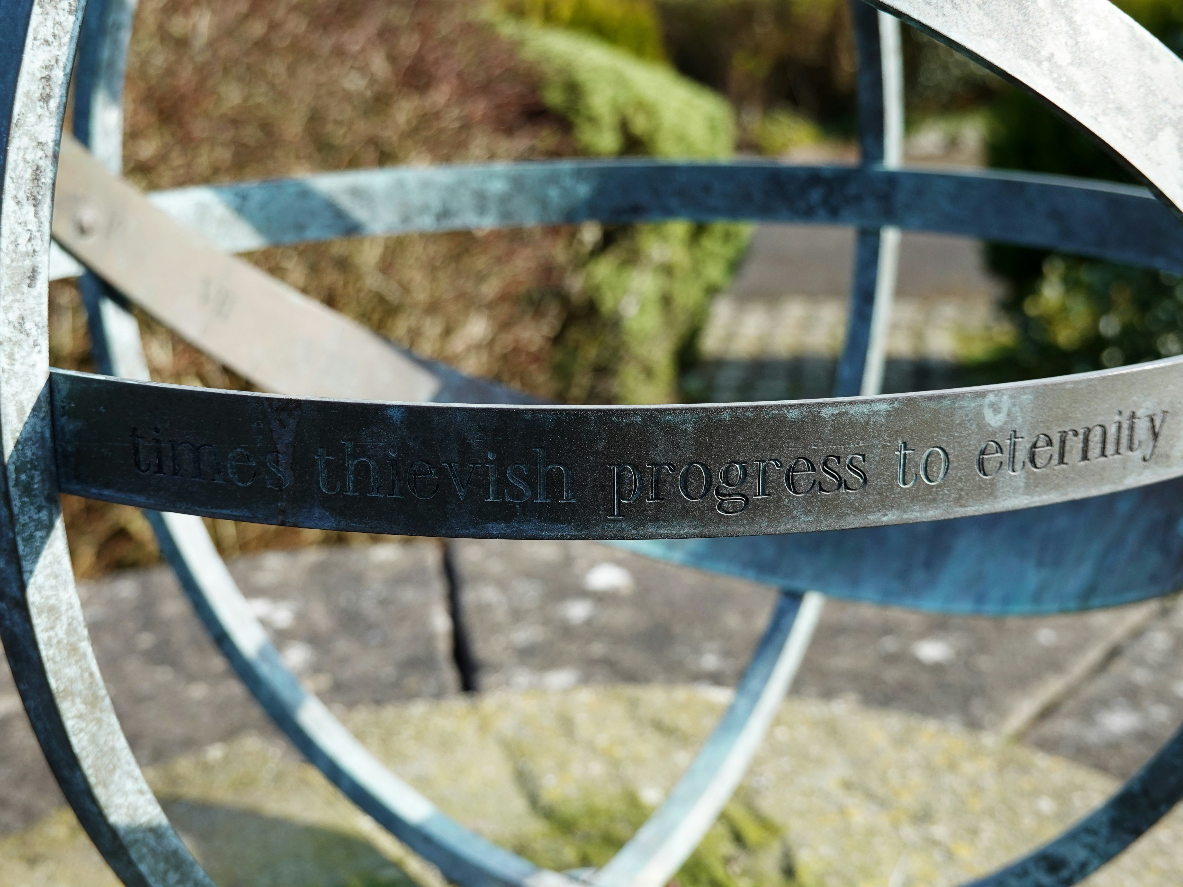 Inscribed Wisdom: A Weathered Metal Ring Weave