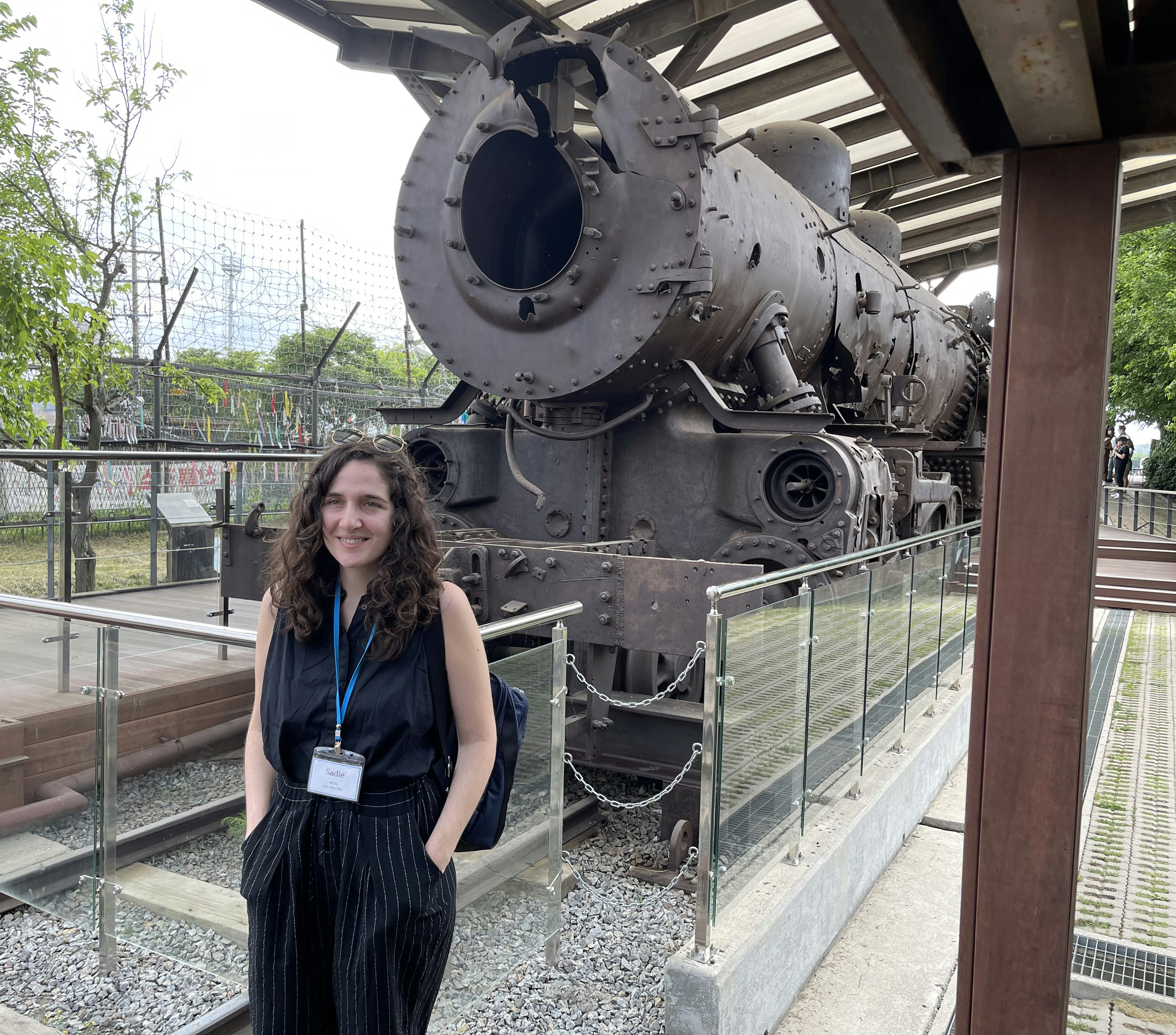 Youth Portrait Before a Historic Locomotive
