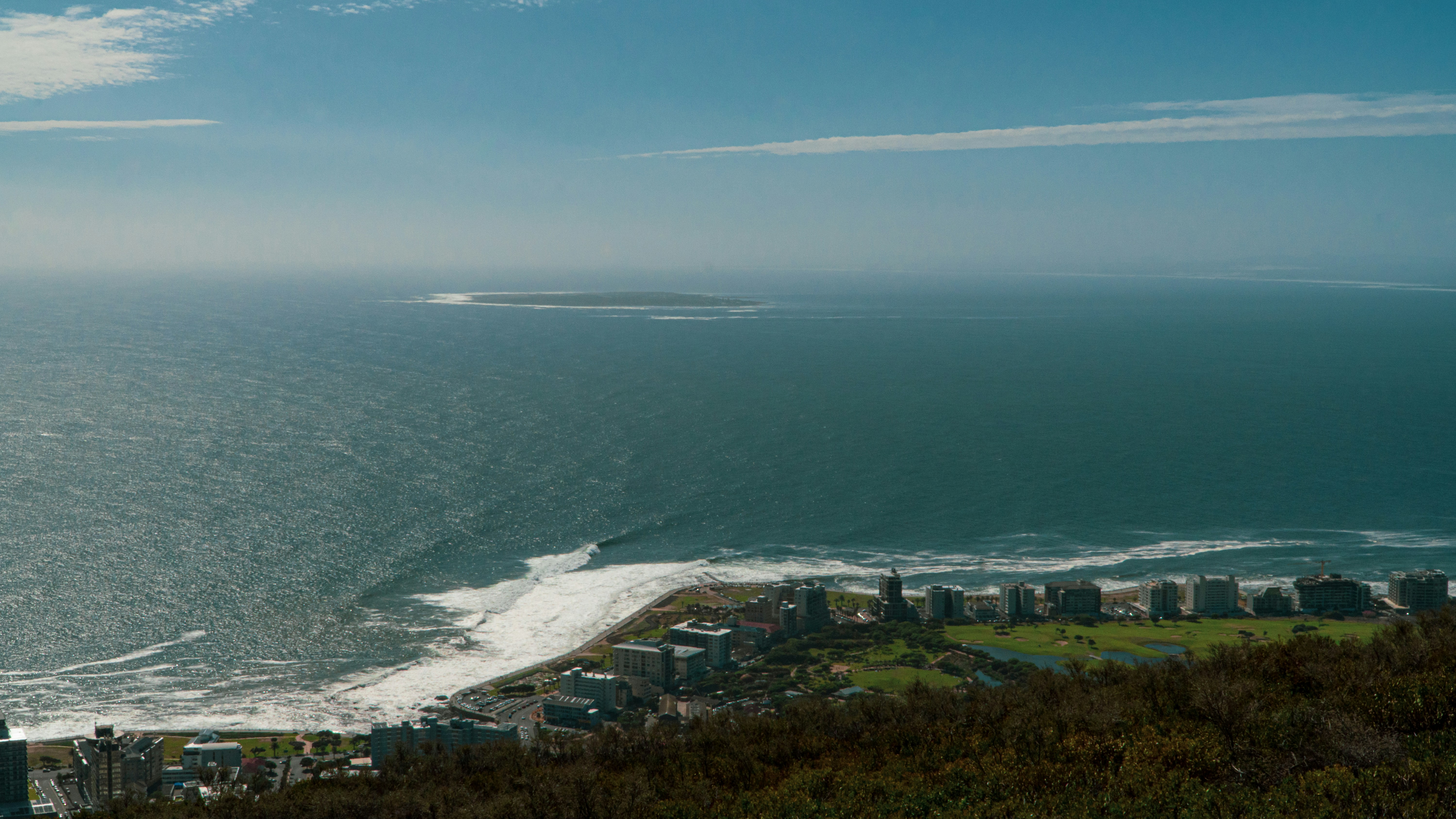 Coastal Edges: A Seashore Panorama from a Cliffside Overlook