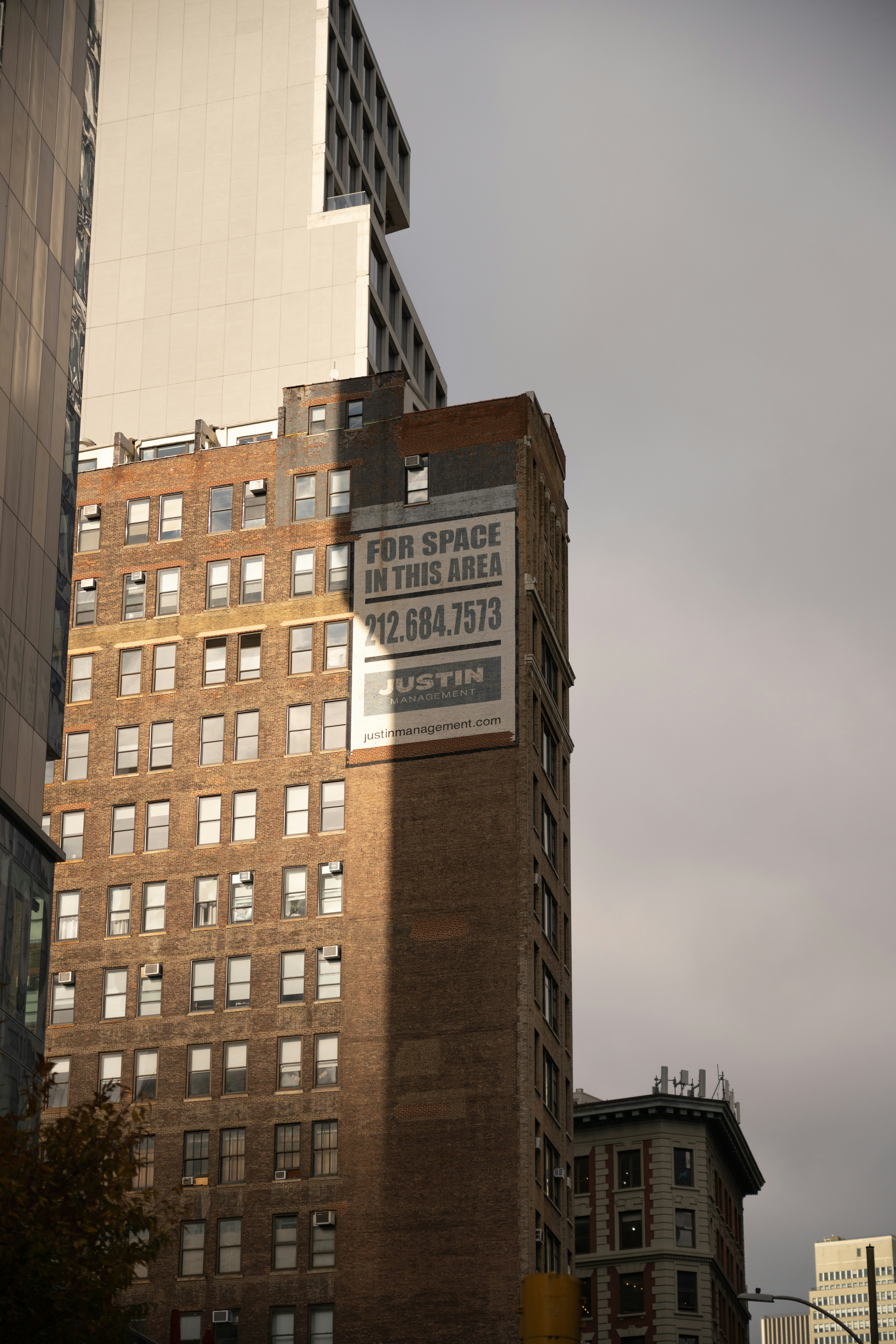 Signage on a brick skyscraper in a city block