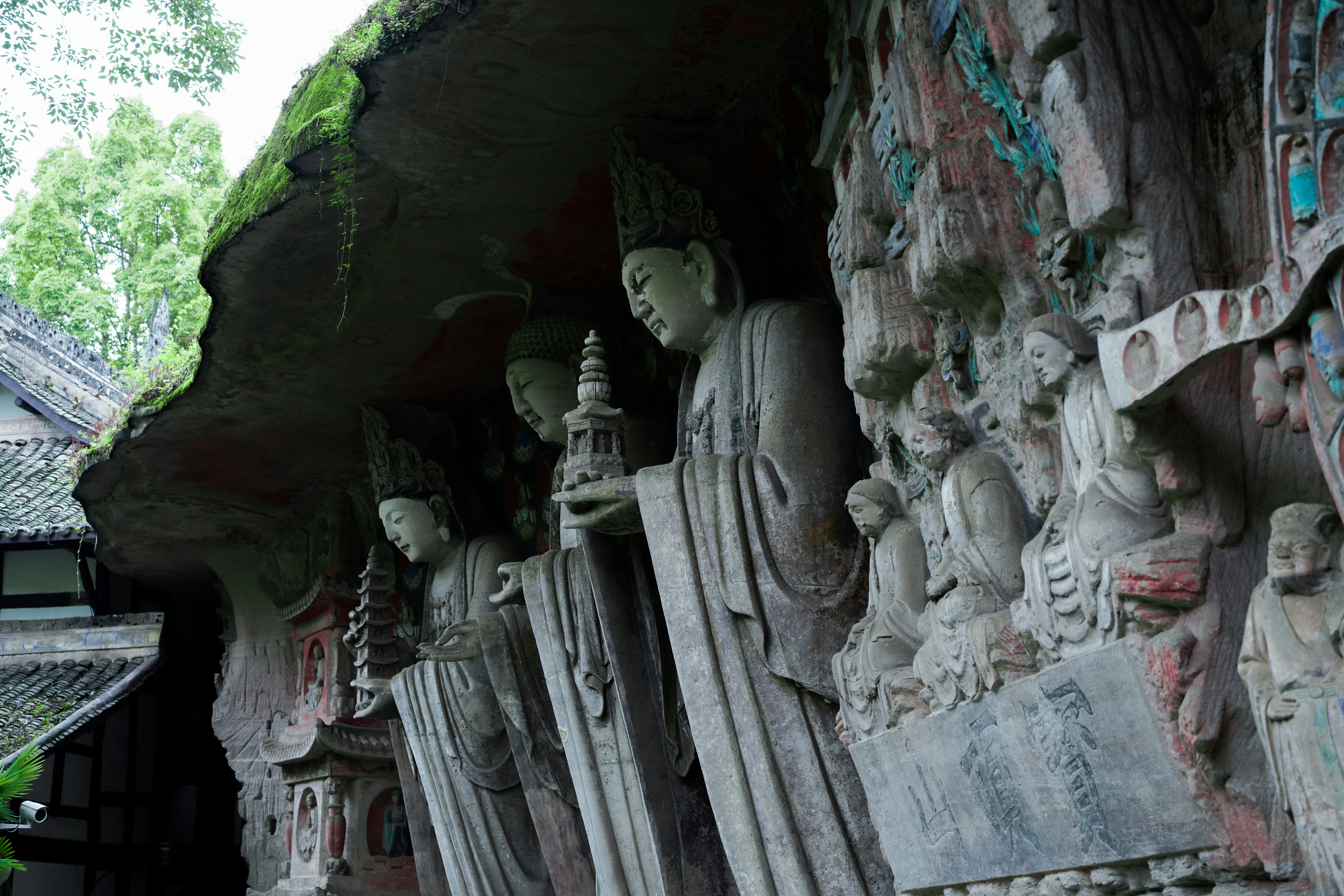 Stone Buddhas in a Shaded Niche: A Quiet Carved Parade