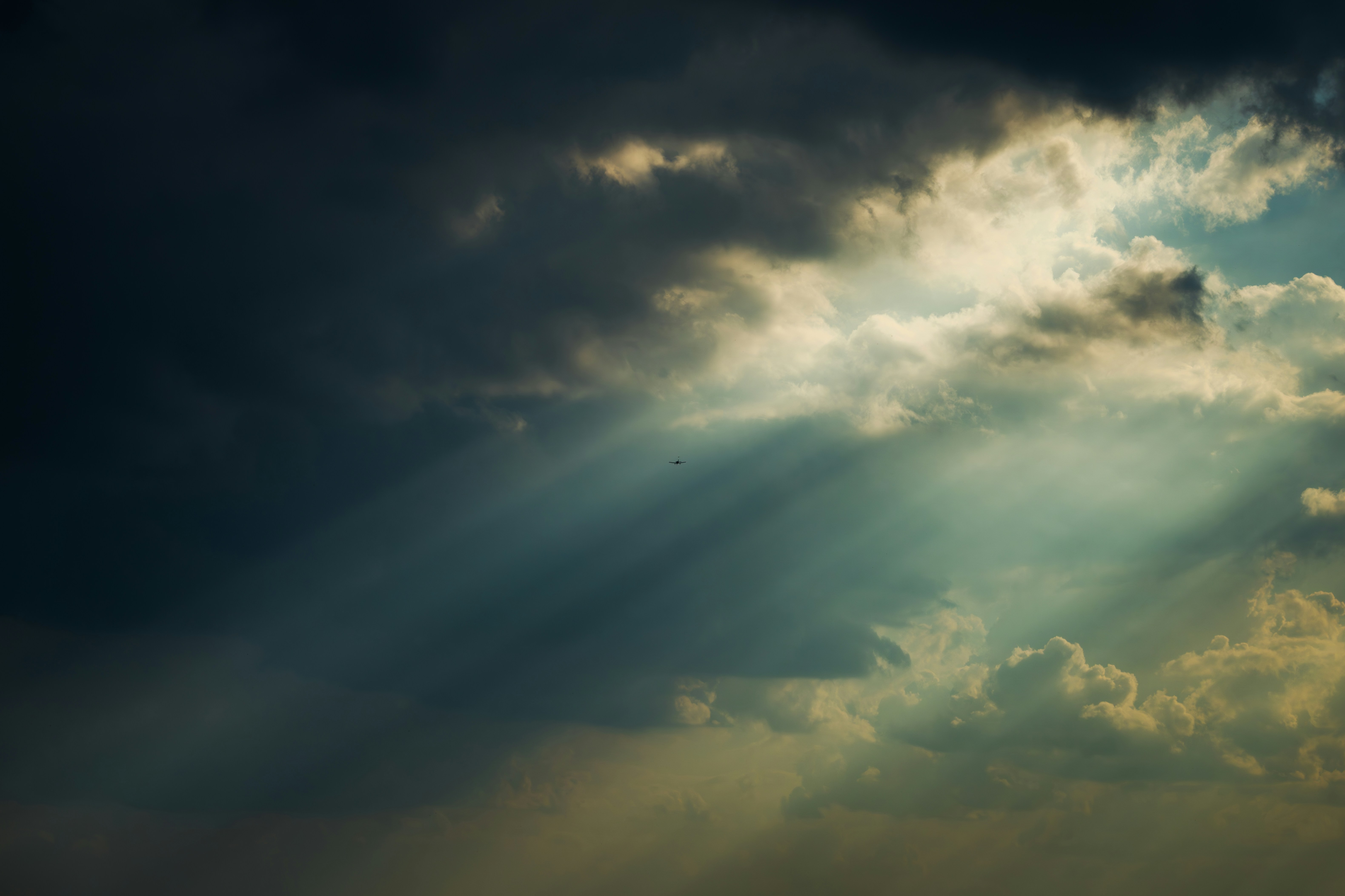 Sunlit Break in the Clouds: Narrow Beams over a Golden Horizon
