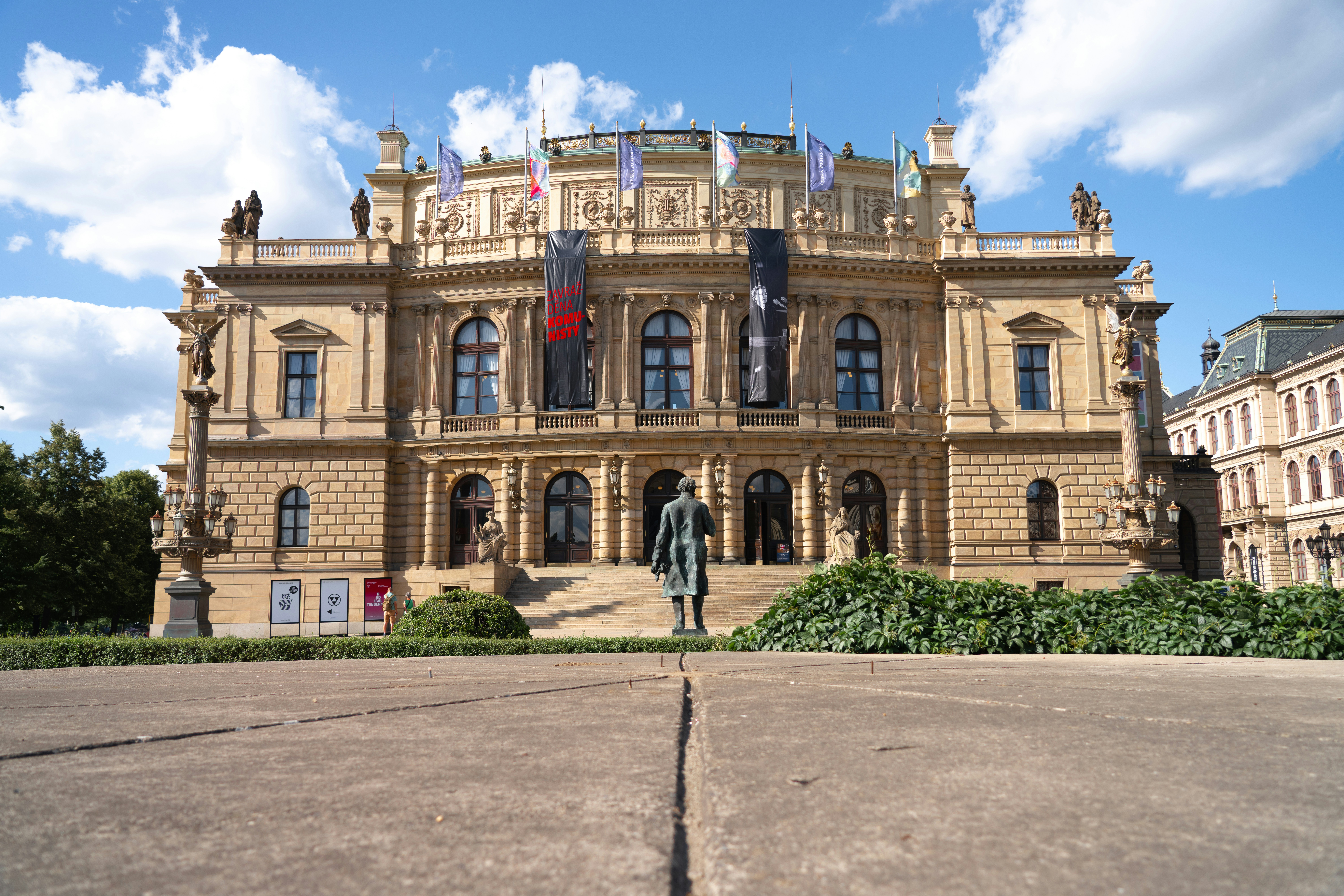 Beacon on the Steps: A Stately Library Facade Framed by a Sole Figure