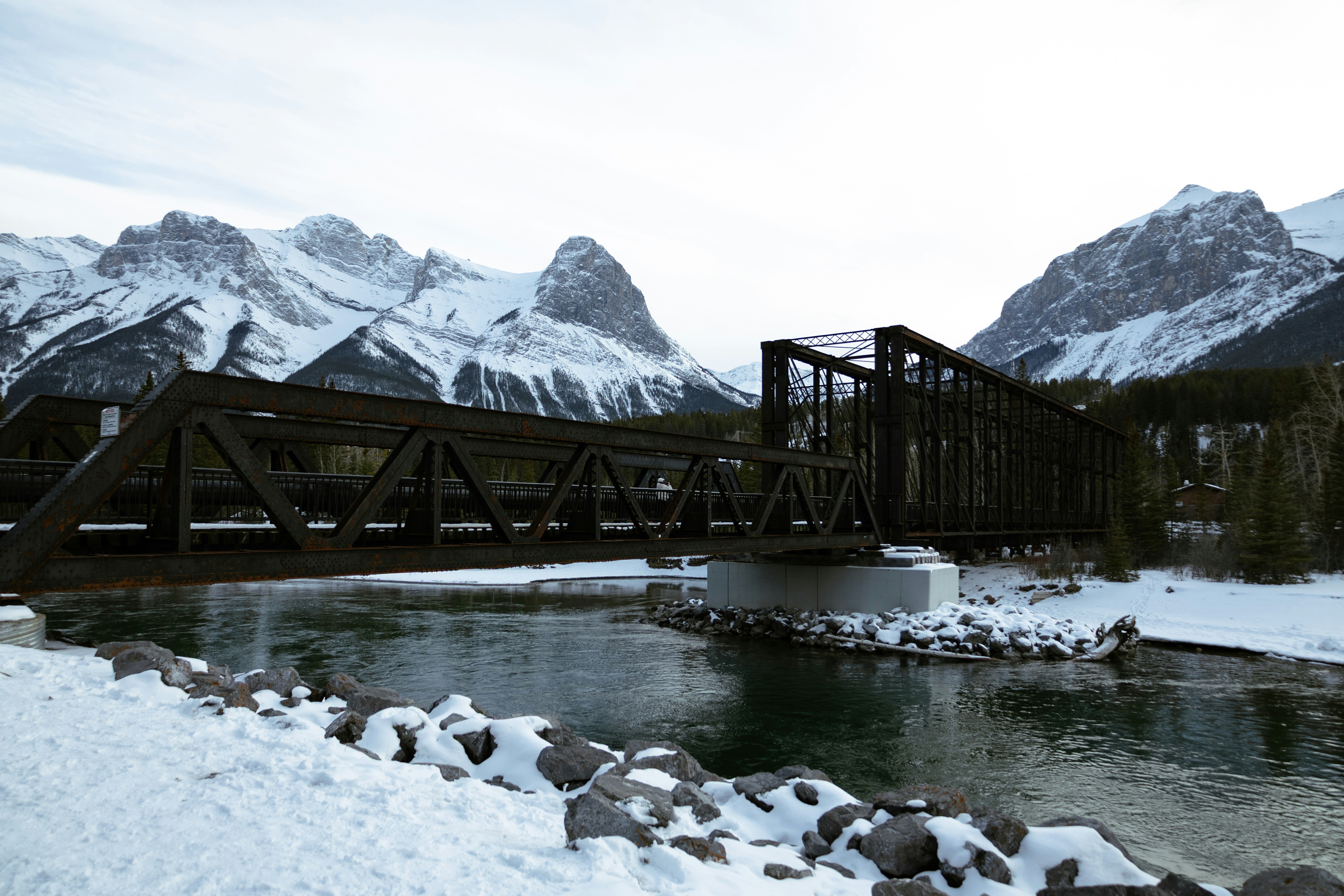 Snowbound Bridge Against Alpine Peaks