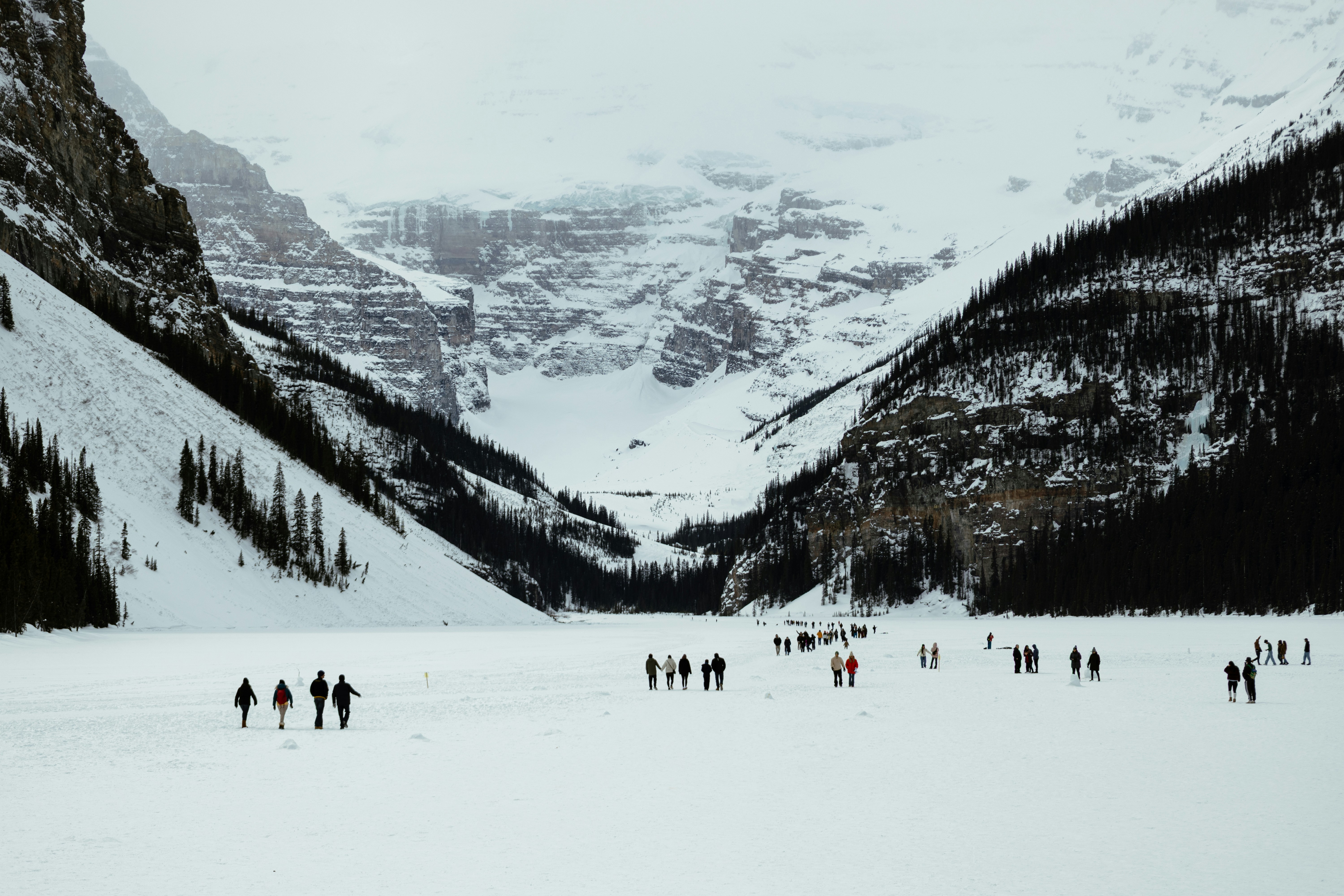 Glacial Valley Trek: A Line of Travelers Through Snowbound Silence
