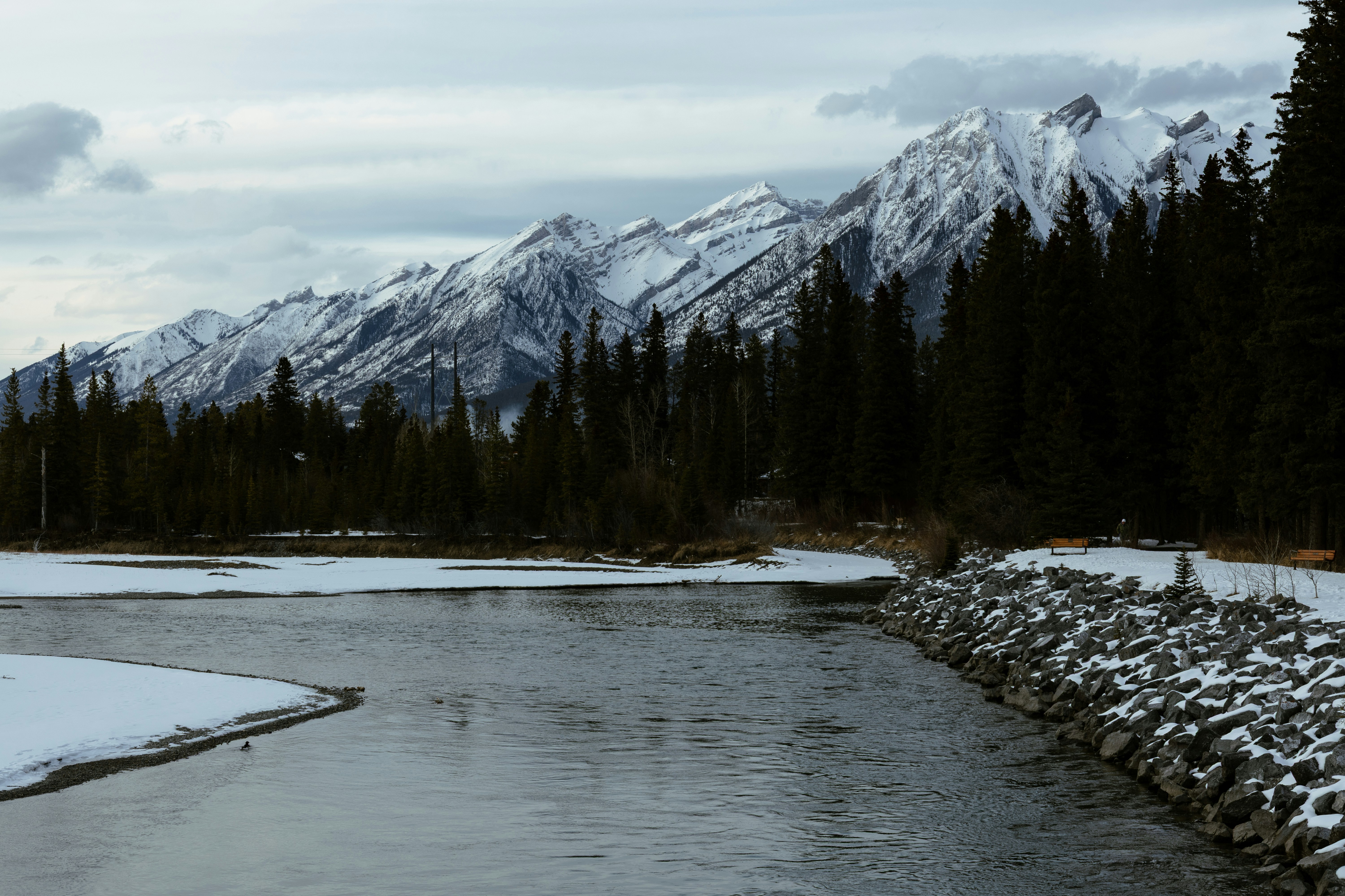 Snowy Peaks Over a Ribbon of River