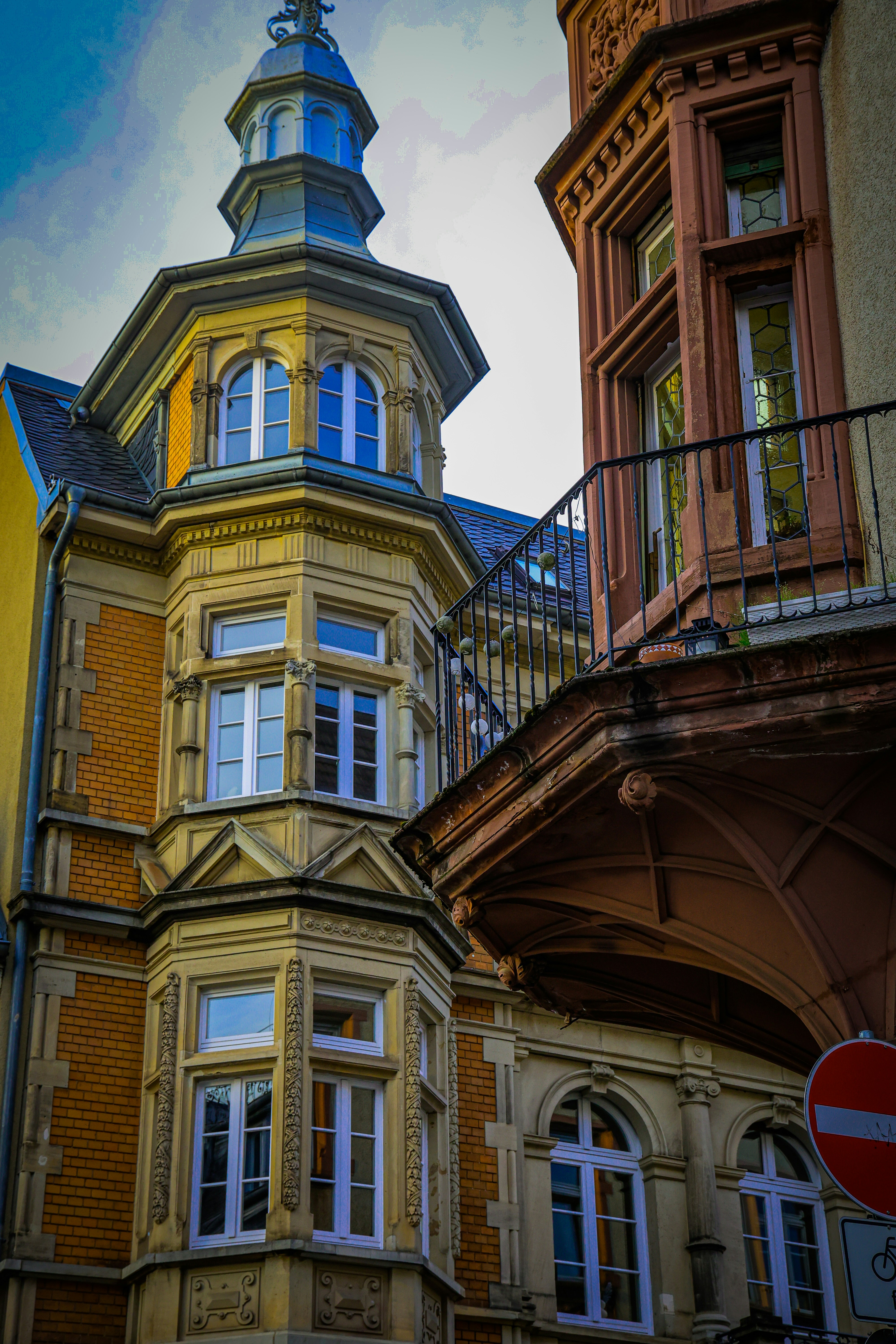 Ornate turreted facade: a corner dream of brick and plaster