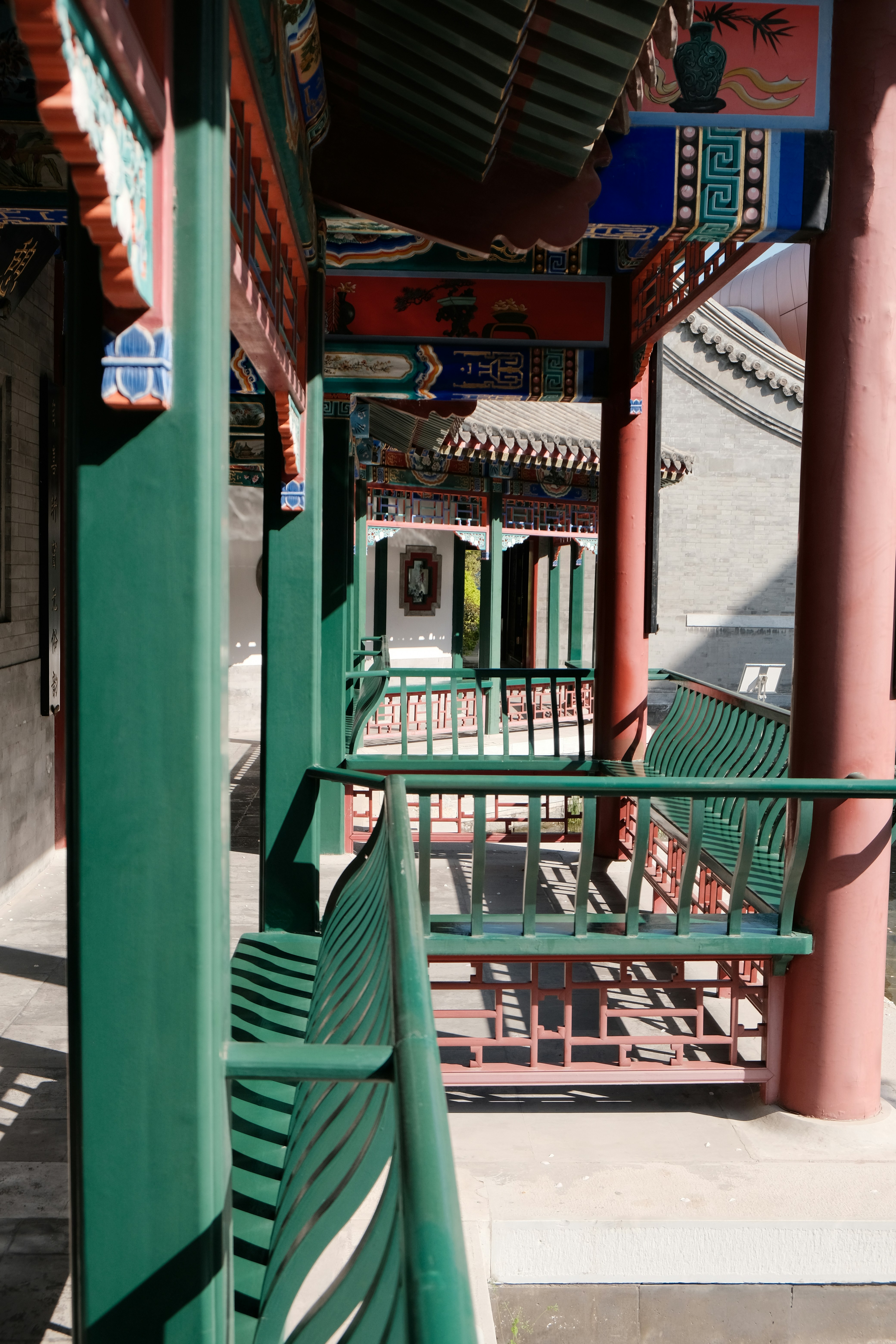 Green Railing Corridor in a Colorful Asian Pavilion