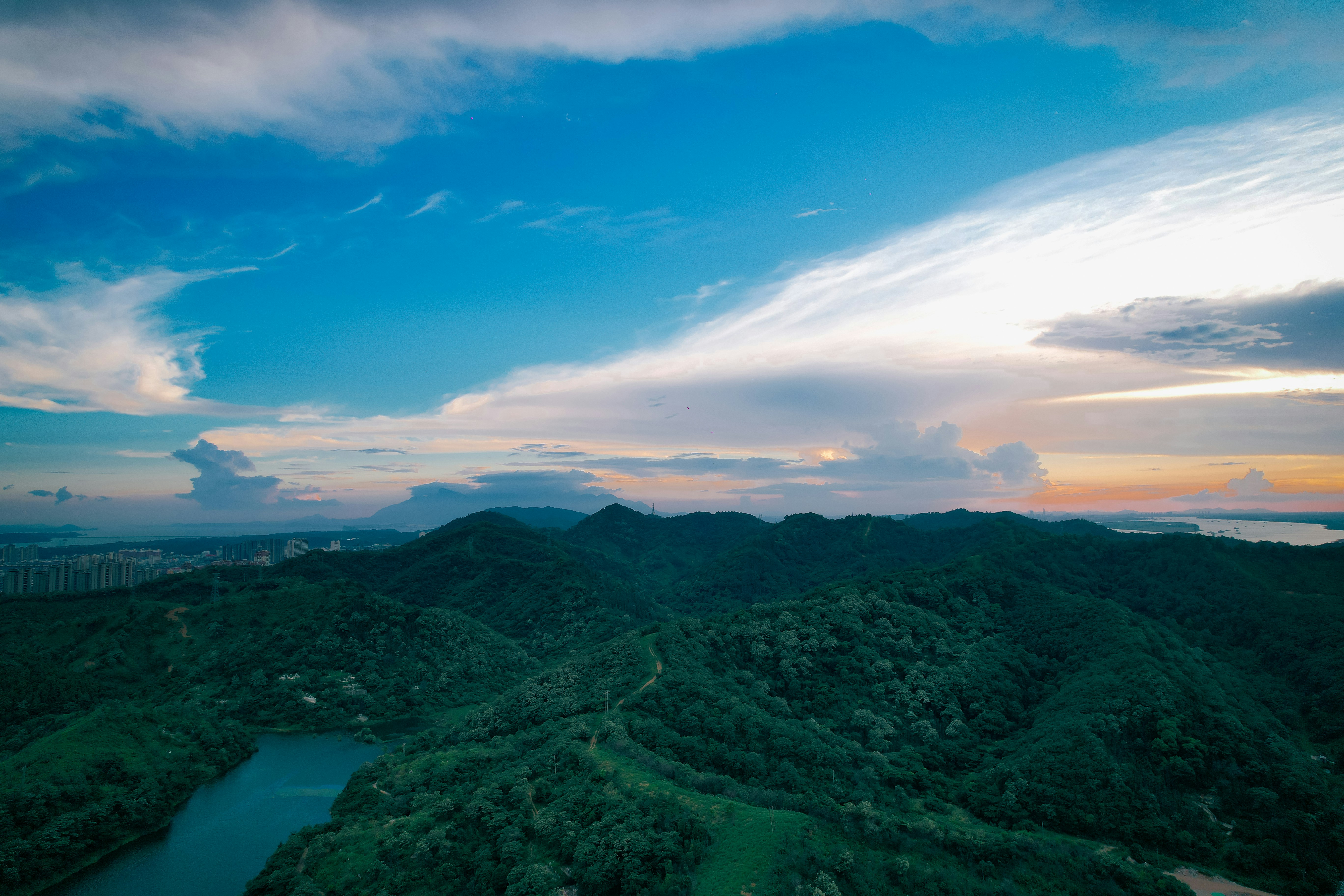 Horizon Over Verdant Ridges at Dusk