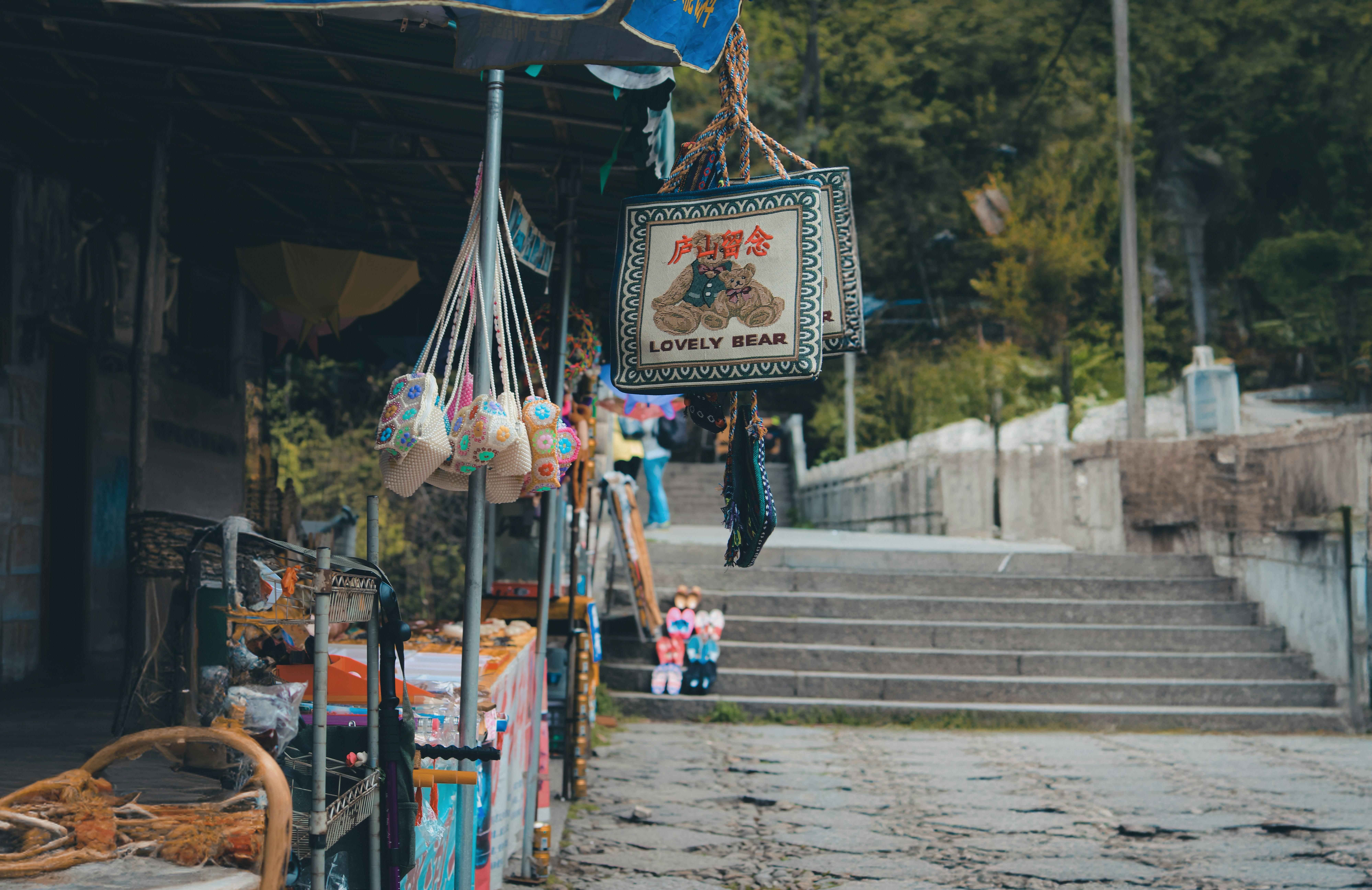 Lanterns and Signboard Overlook a Quiet Market Path