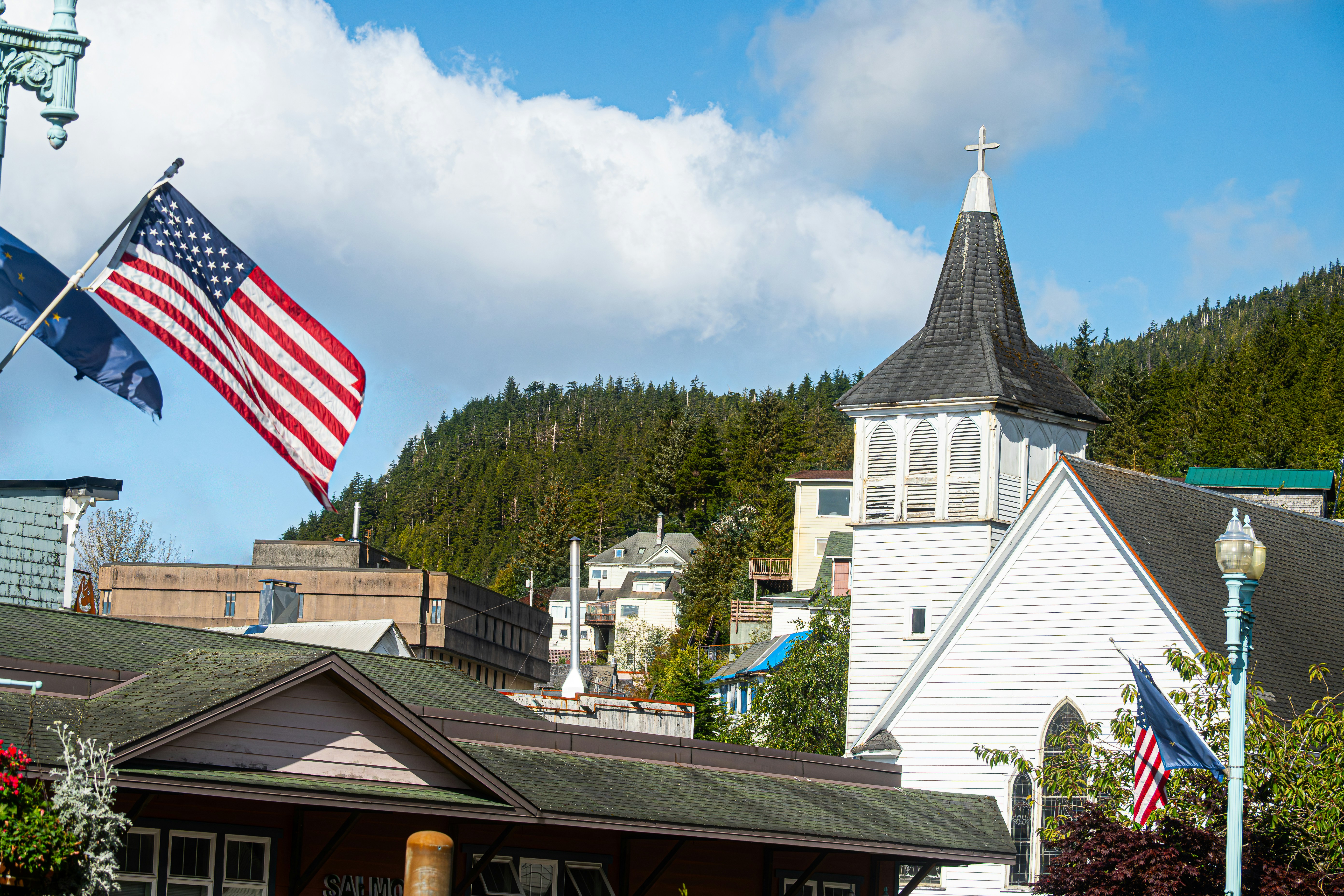 American Town Square: Flags, Chapel Bell, and Gentle Hills