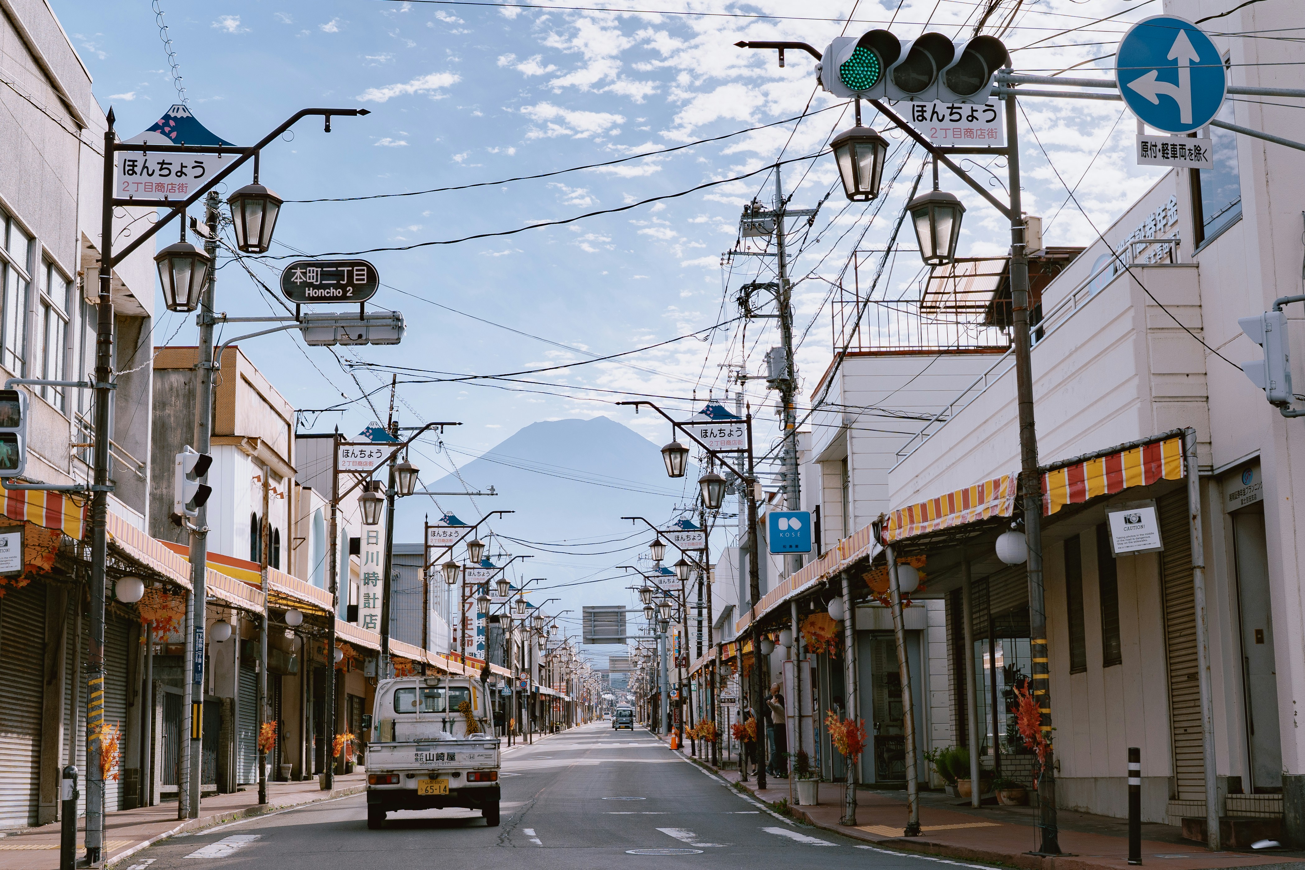 Symmetrical Main Street Leading Toward a Distant Peak