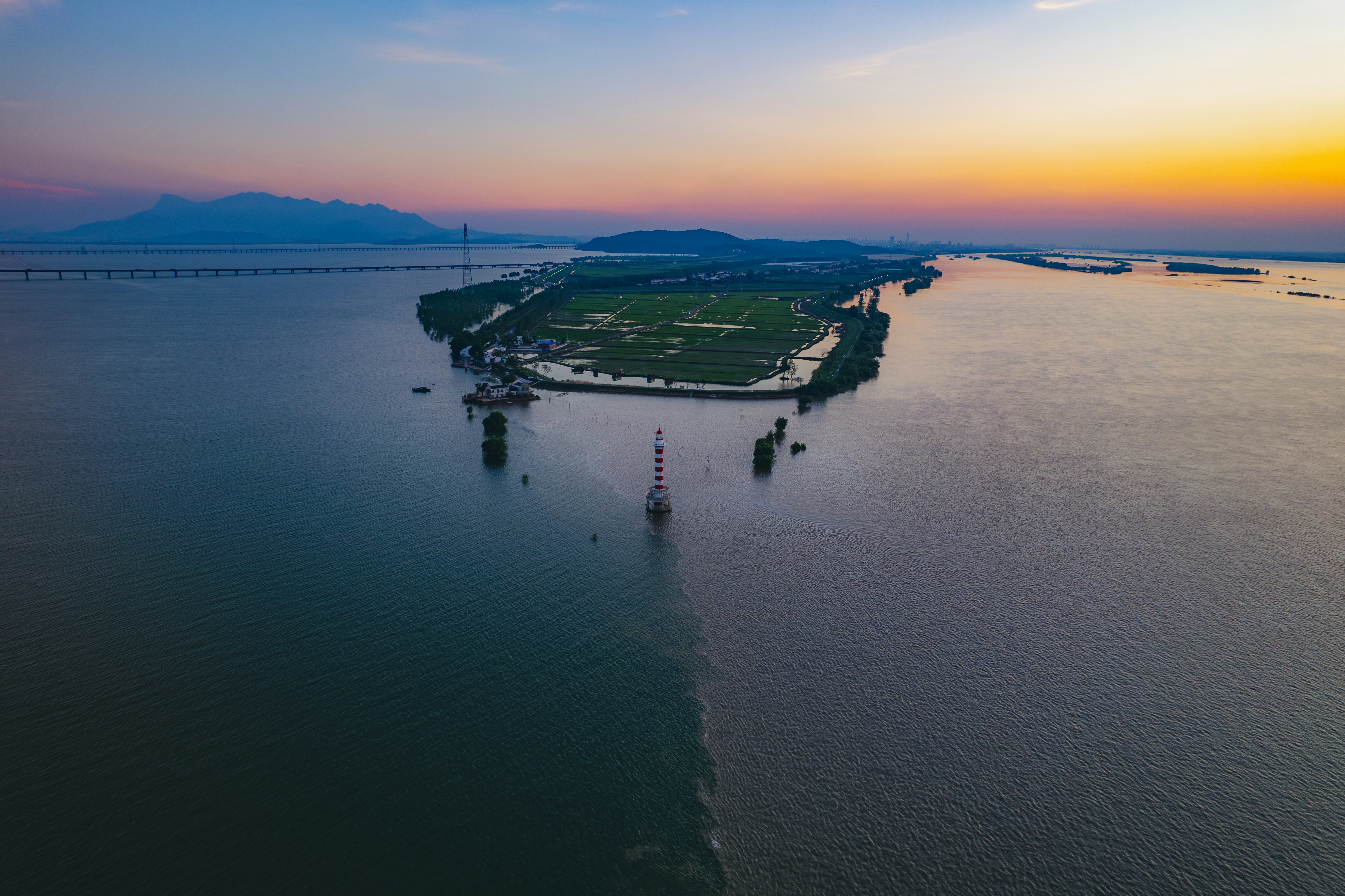 Sunset Over an Island Sprawl: Aerial Frame of a Coastal Complex