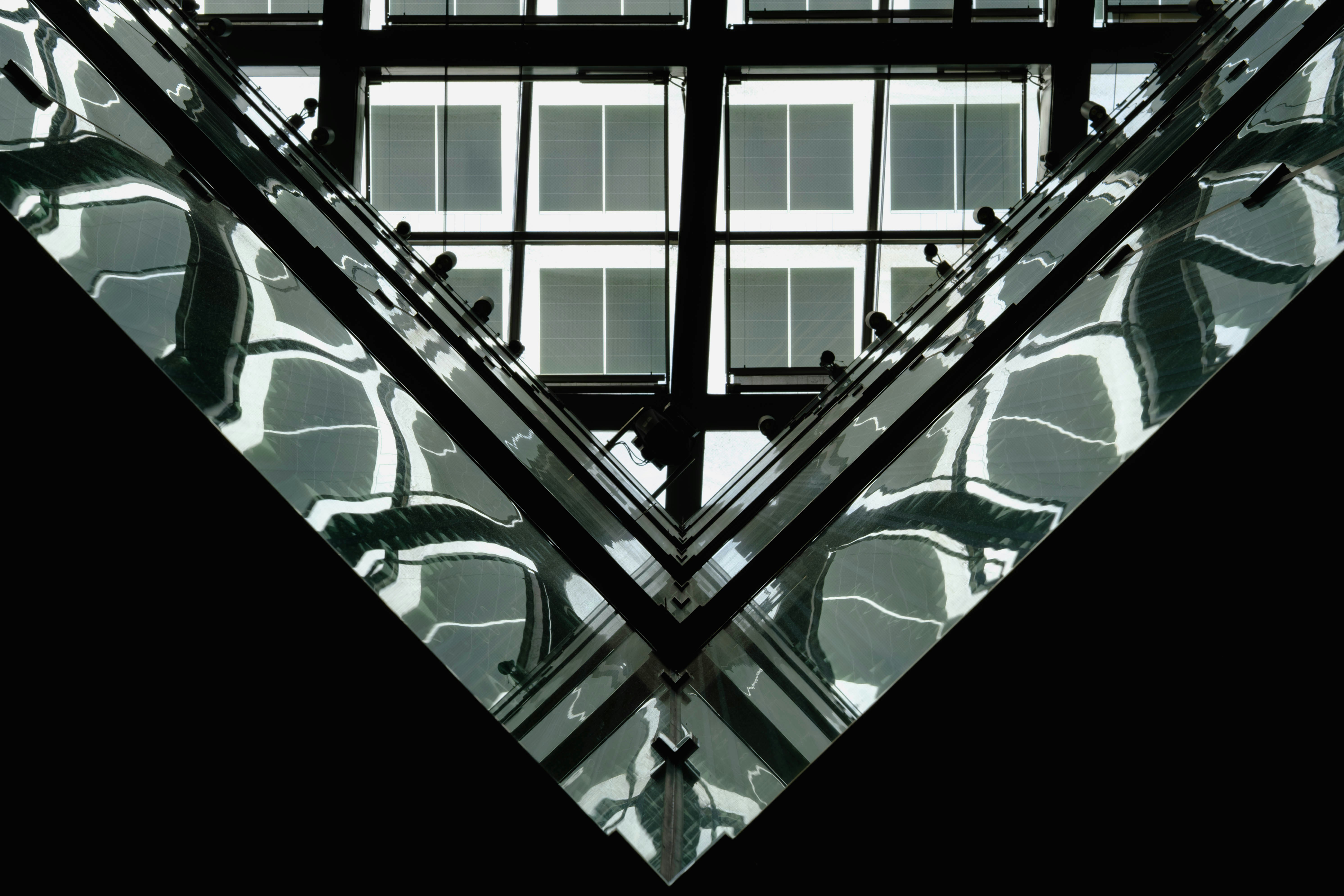 Converging Glass Facades: a Triangular Intersection of Reflections
