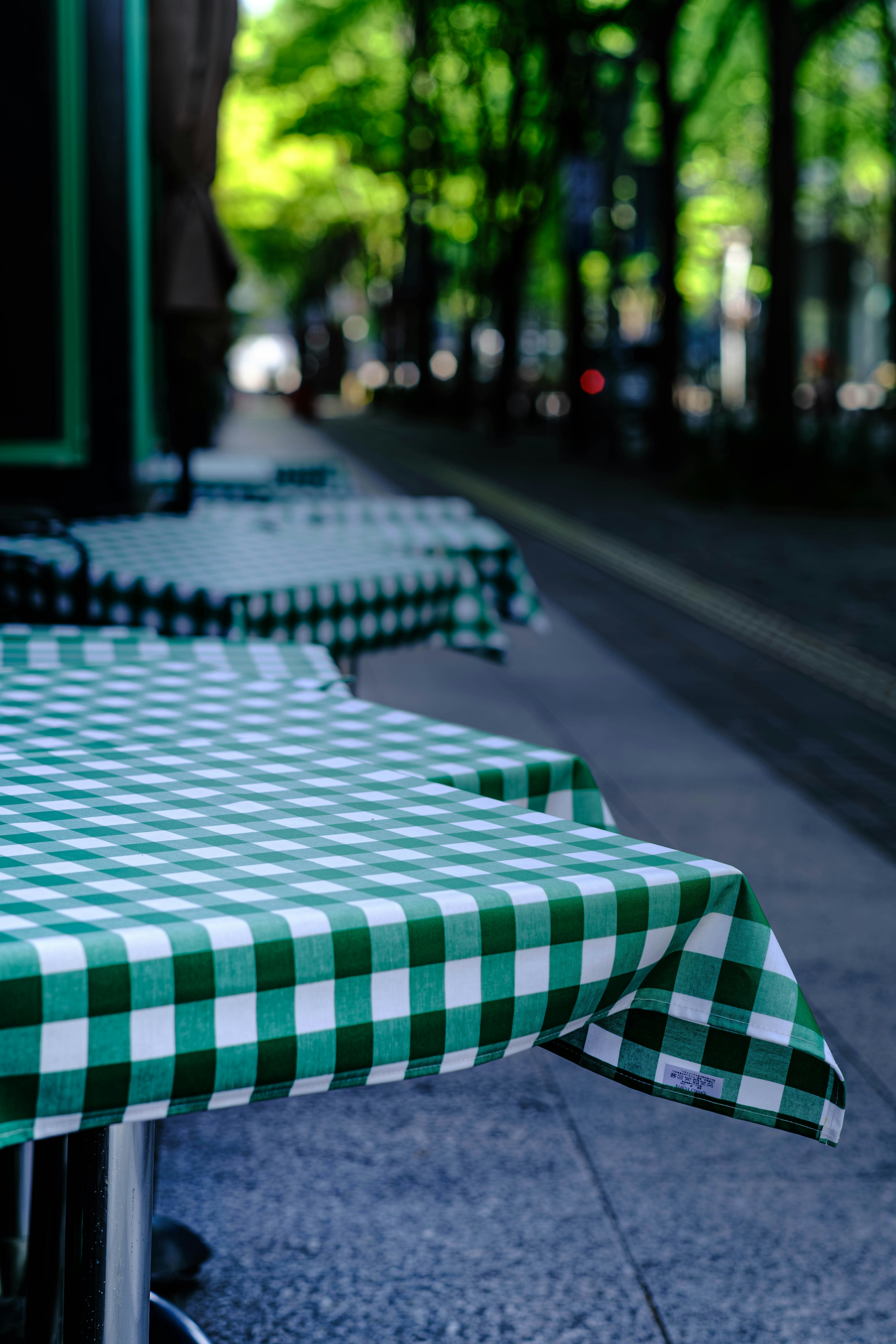 Green-Checked Tables on a Quiet City Street