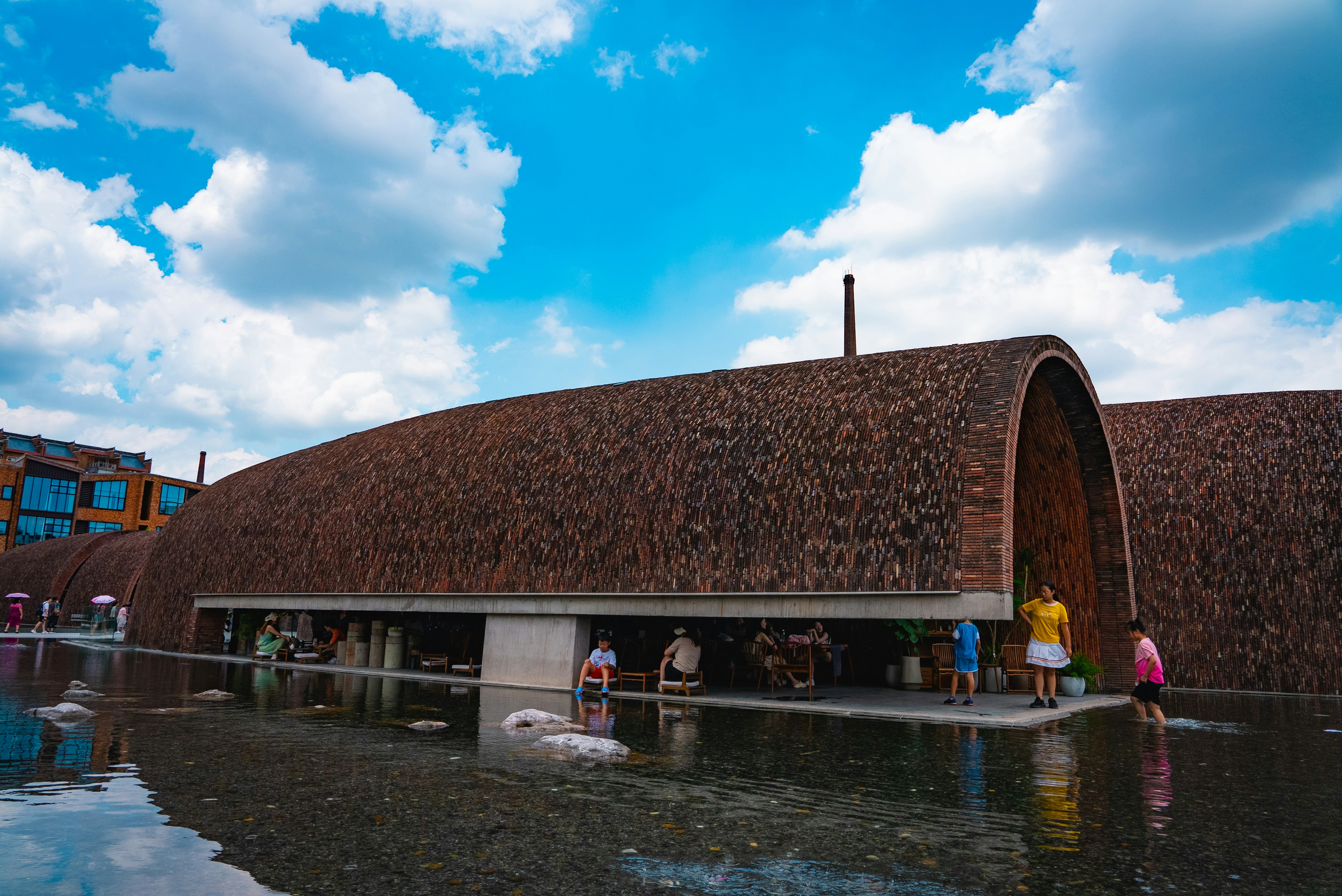 Architectural Arc: People at the Brick Domed Curve