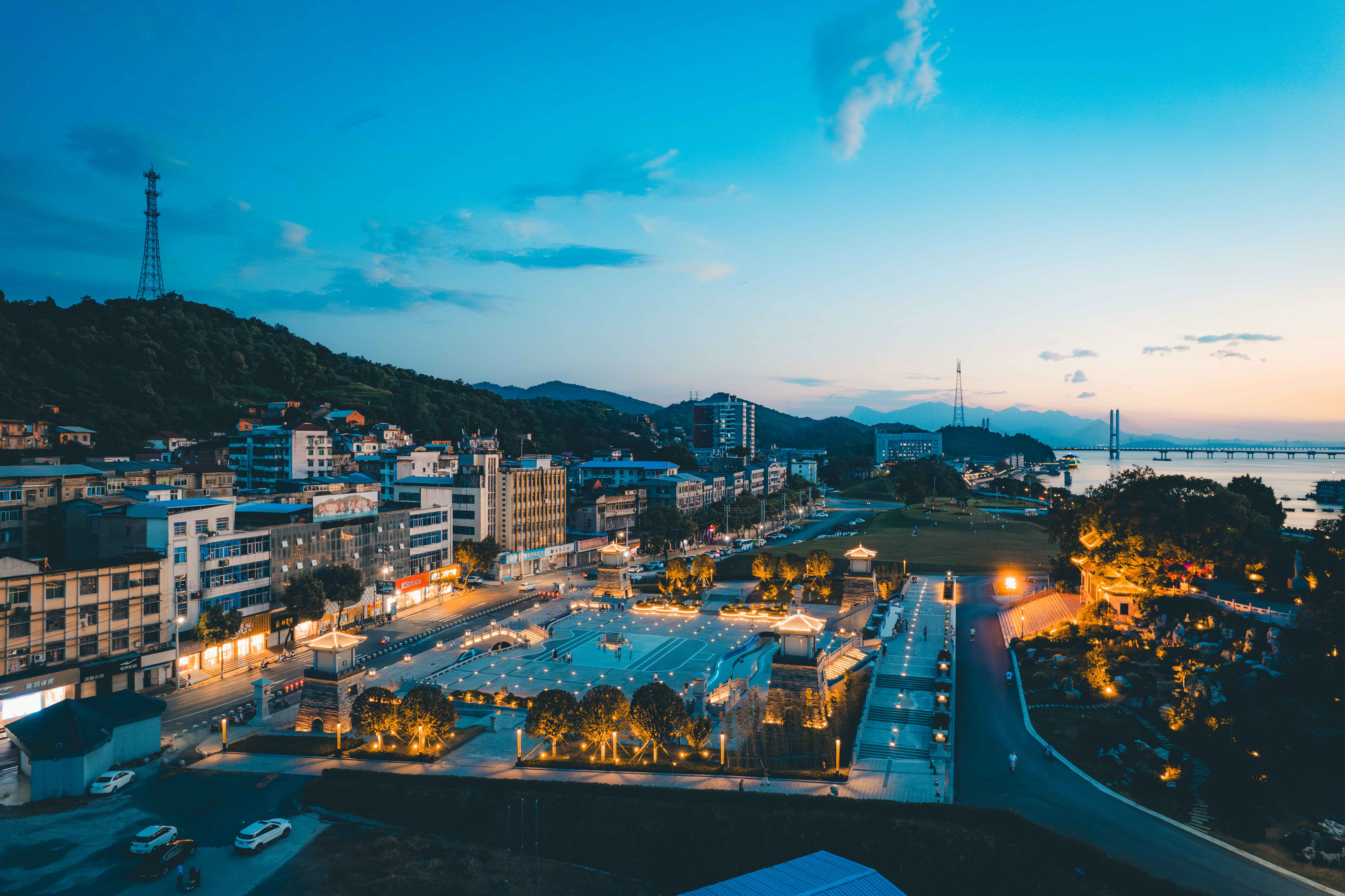 Twilight Terrace: A Coastal Town Emerges from Dusk