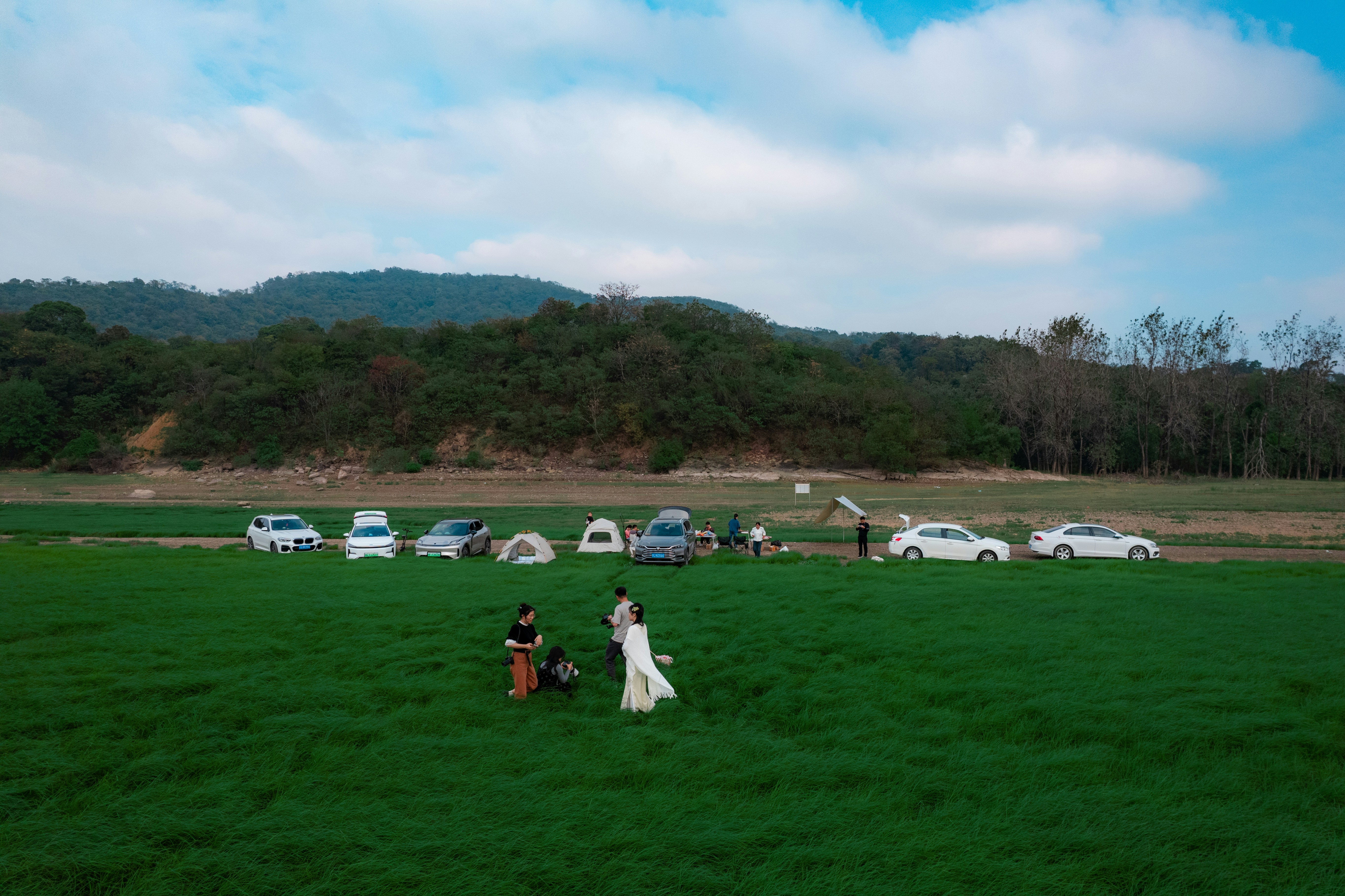 Green Meadow Dance: A Wedding Moment Under Open Skies