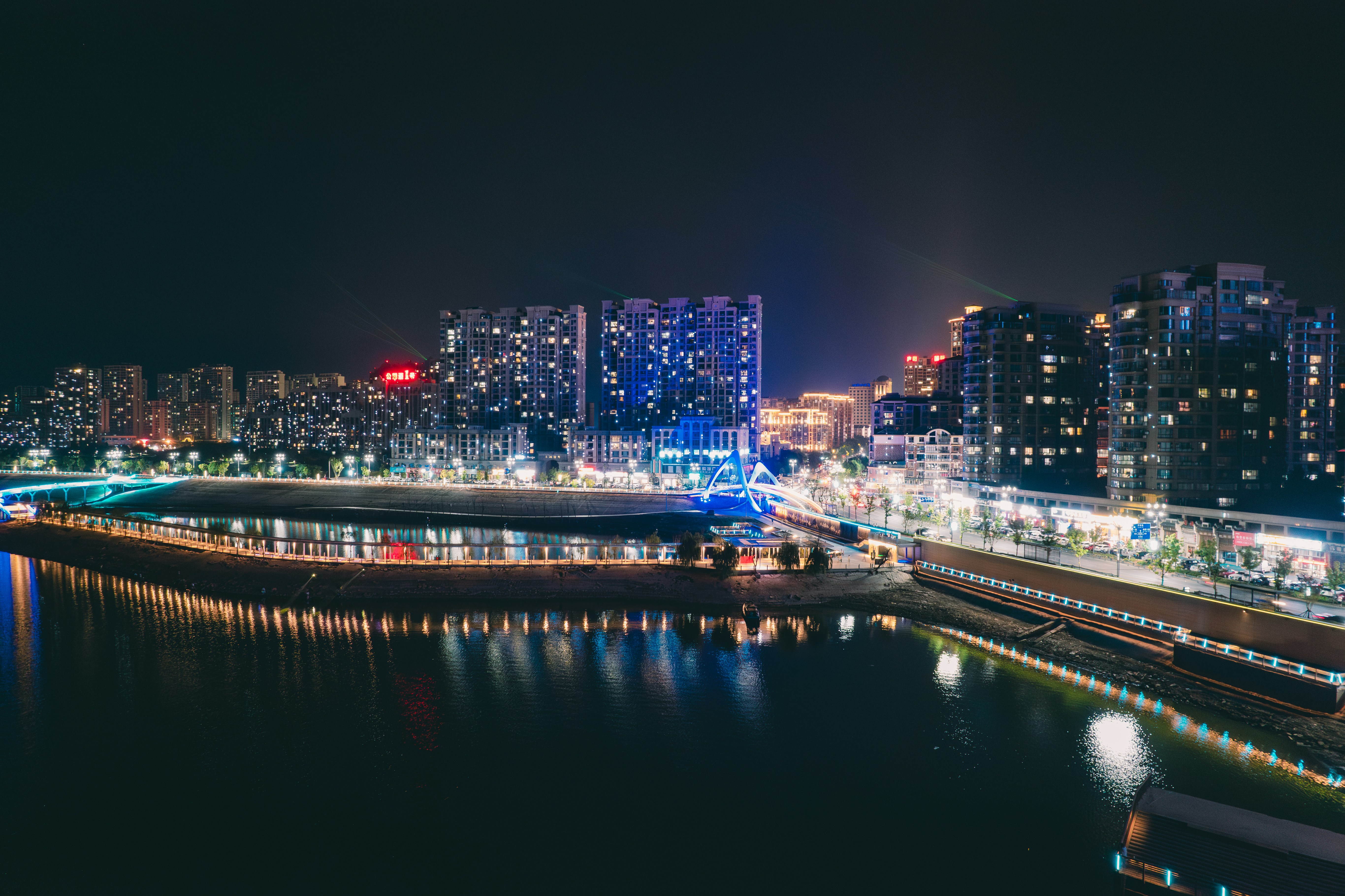 Neon River Crossing: A Nighttime City Glow