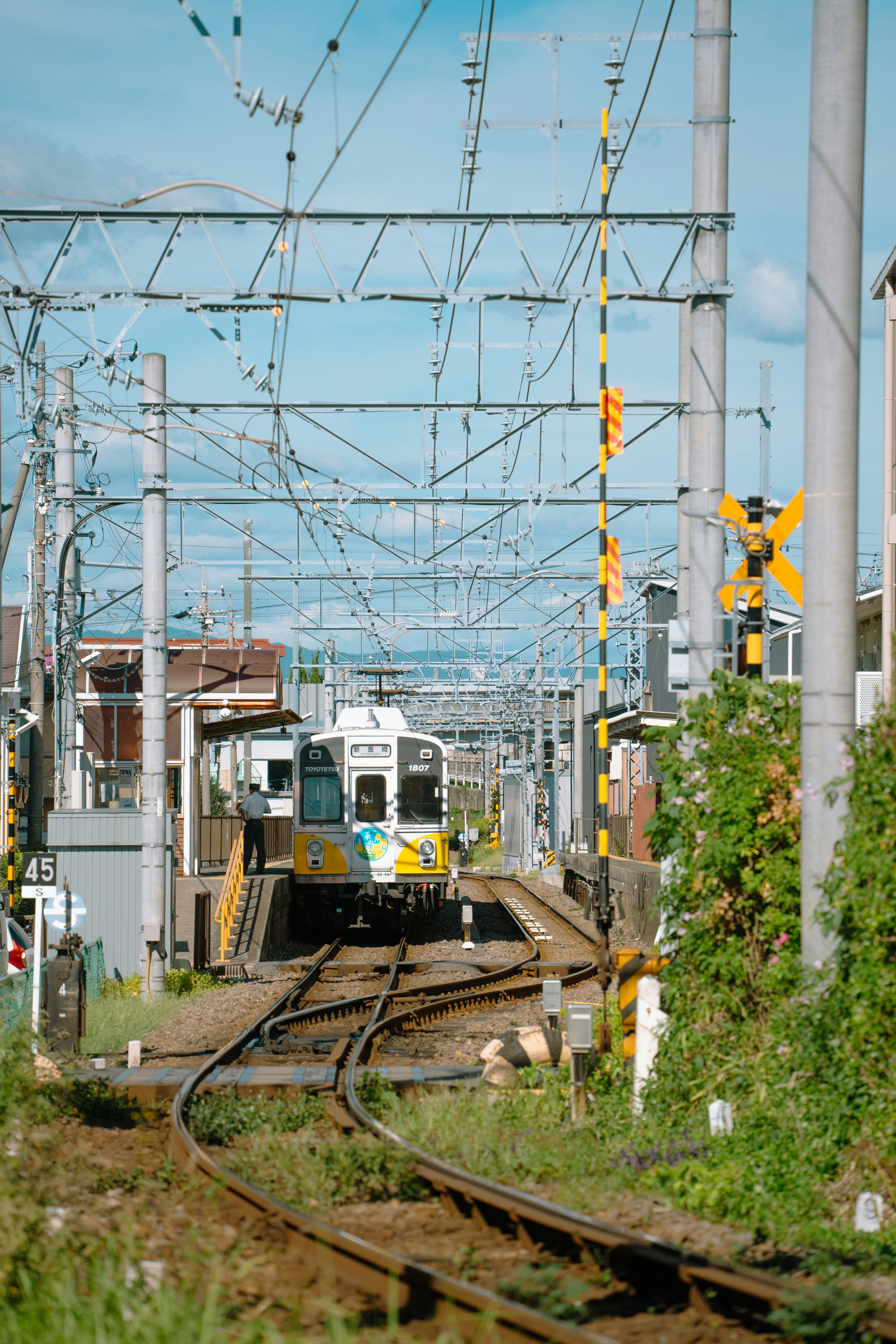 Railway Line Convergence: A Street-Level Moment with a Commuter Train