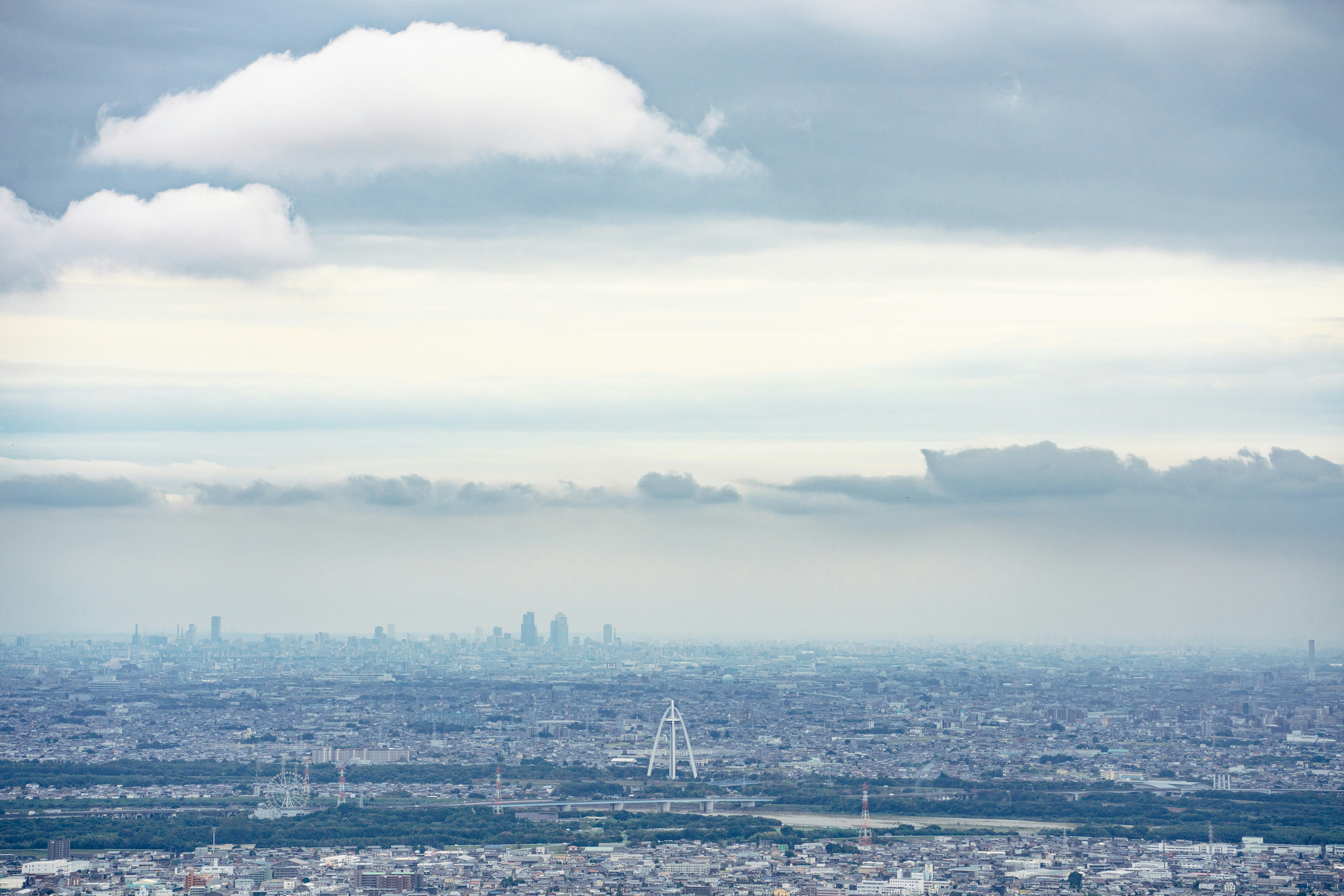 Cityscape Horizon: A distant skyline under a calm, expansive sky