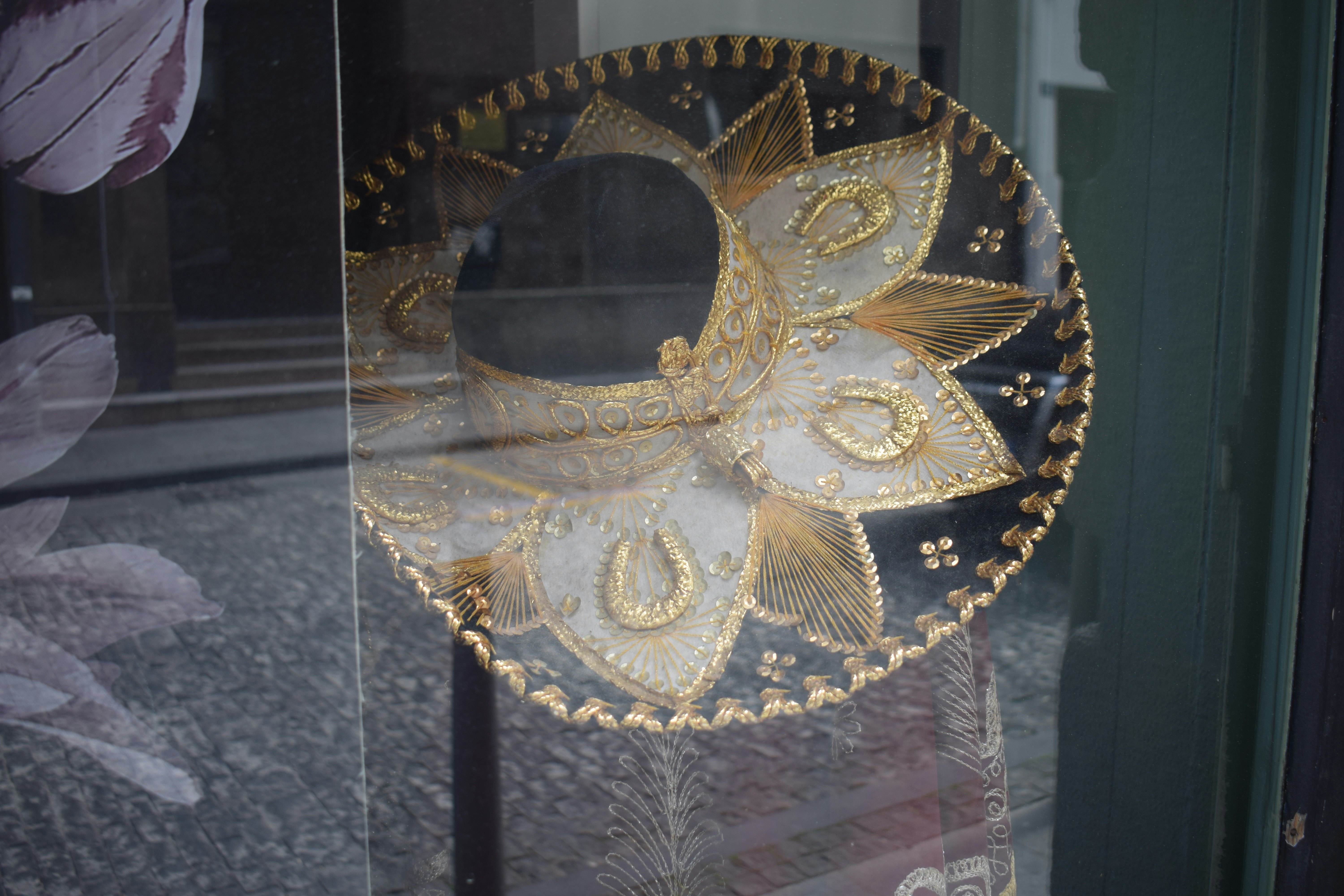 Golden Disc in a Glass Corridor