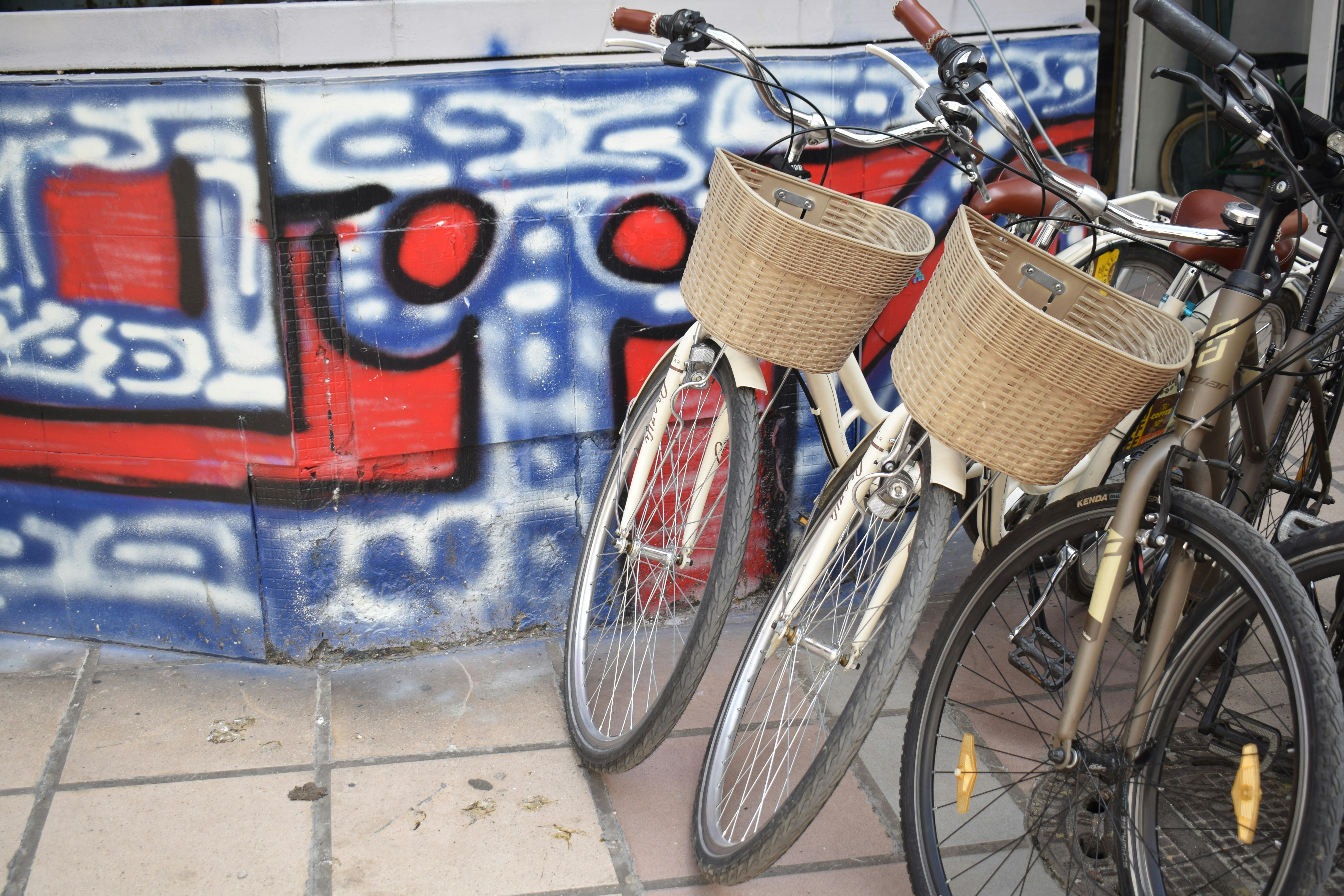 Bike Courtyard Portrait: Baskets in Front of a Graffiti Wall