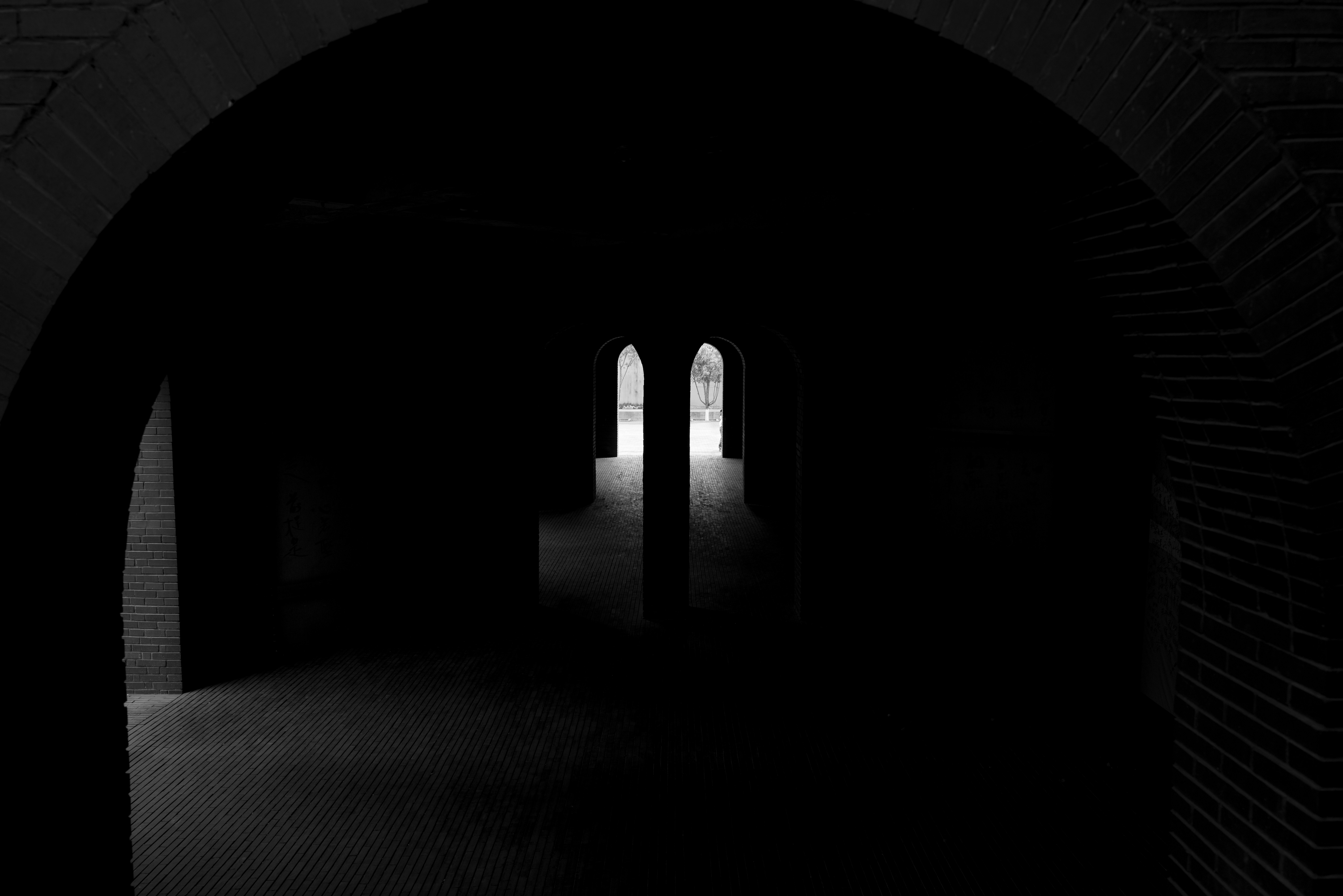 Dark Passage: Revealing Light Through A Series of Narrow Arches
