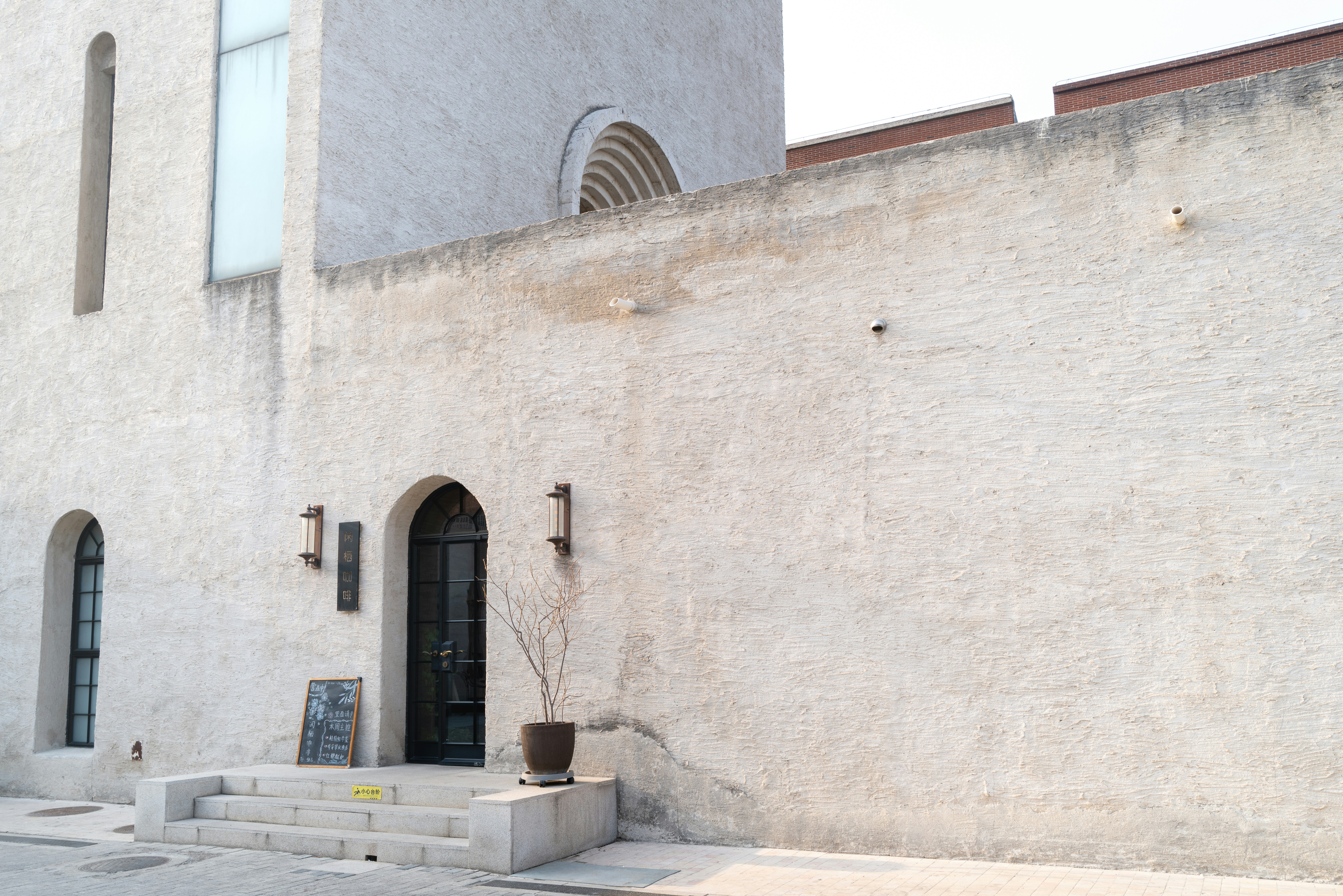 Minimalist Courtyard Facade with Staircase and Doorway