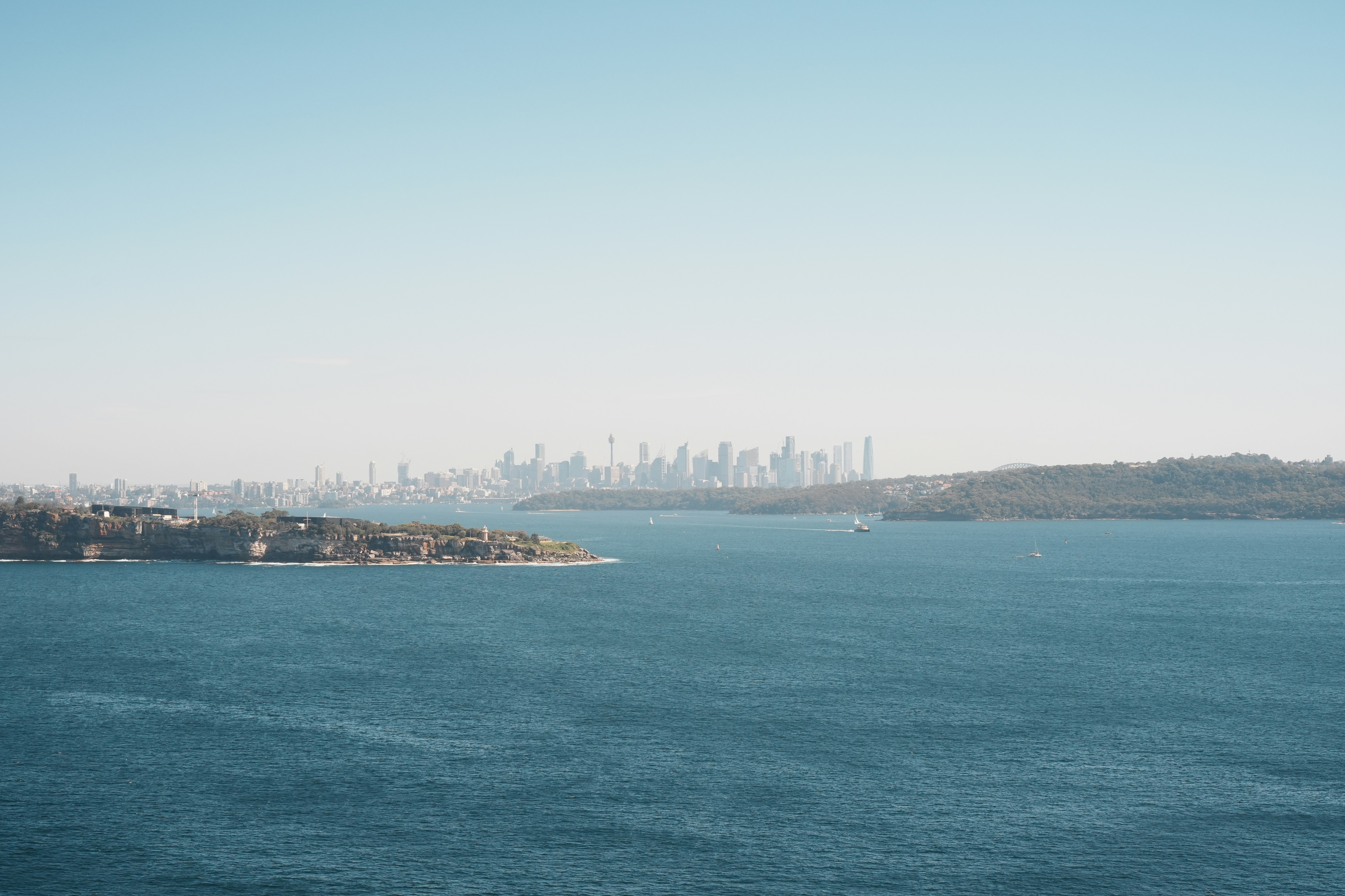 Edge of the Bay: Distant Skyline over Calm Waters