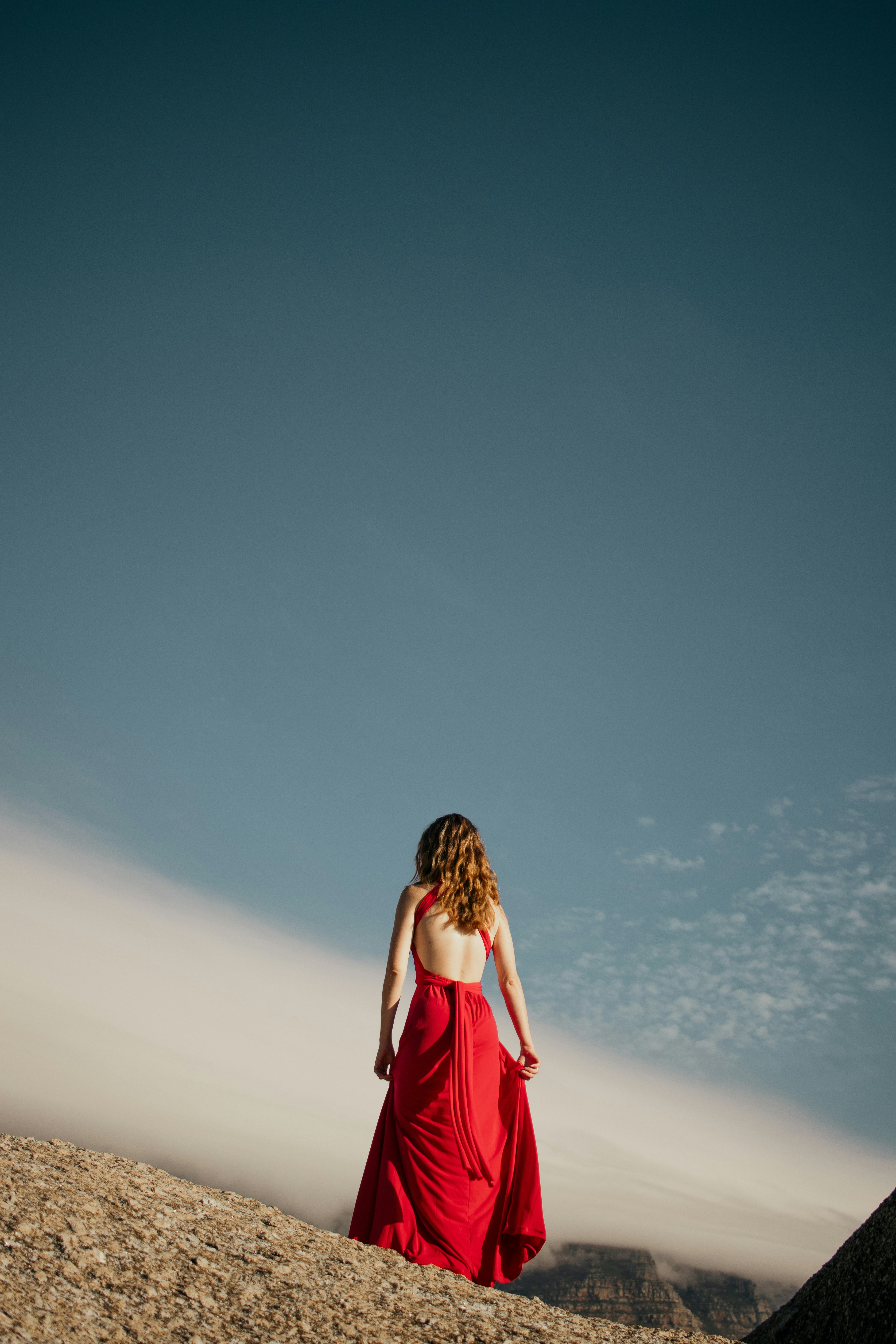 Red dress on the edge of the world