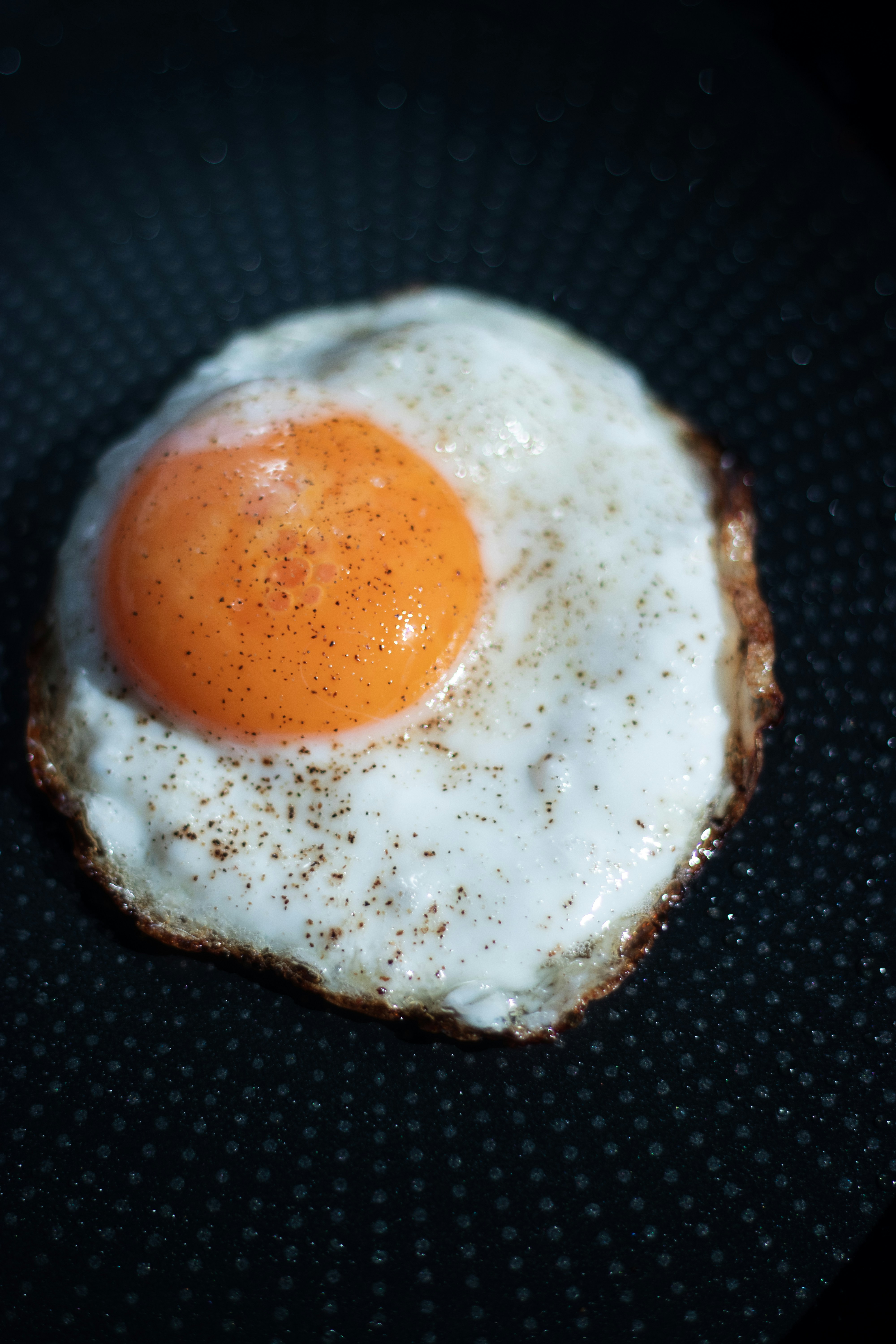 Sunny Side Focus: Golden Egg on a Sizzling Pan