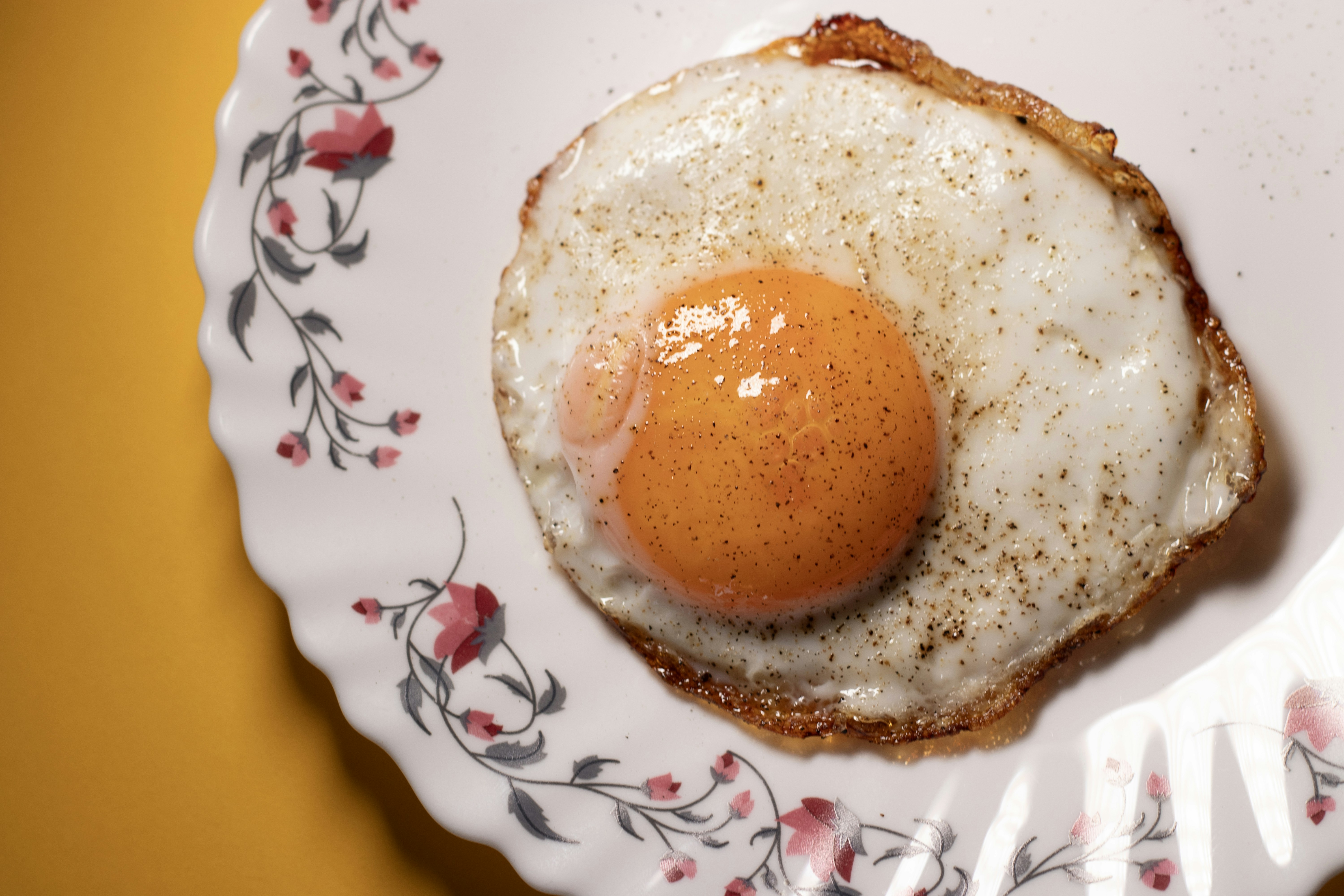 Golden Egg on Floral Rim