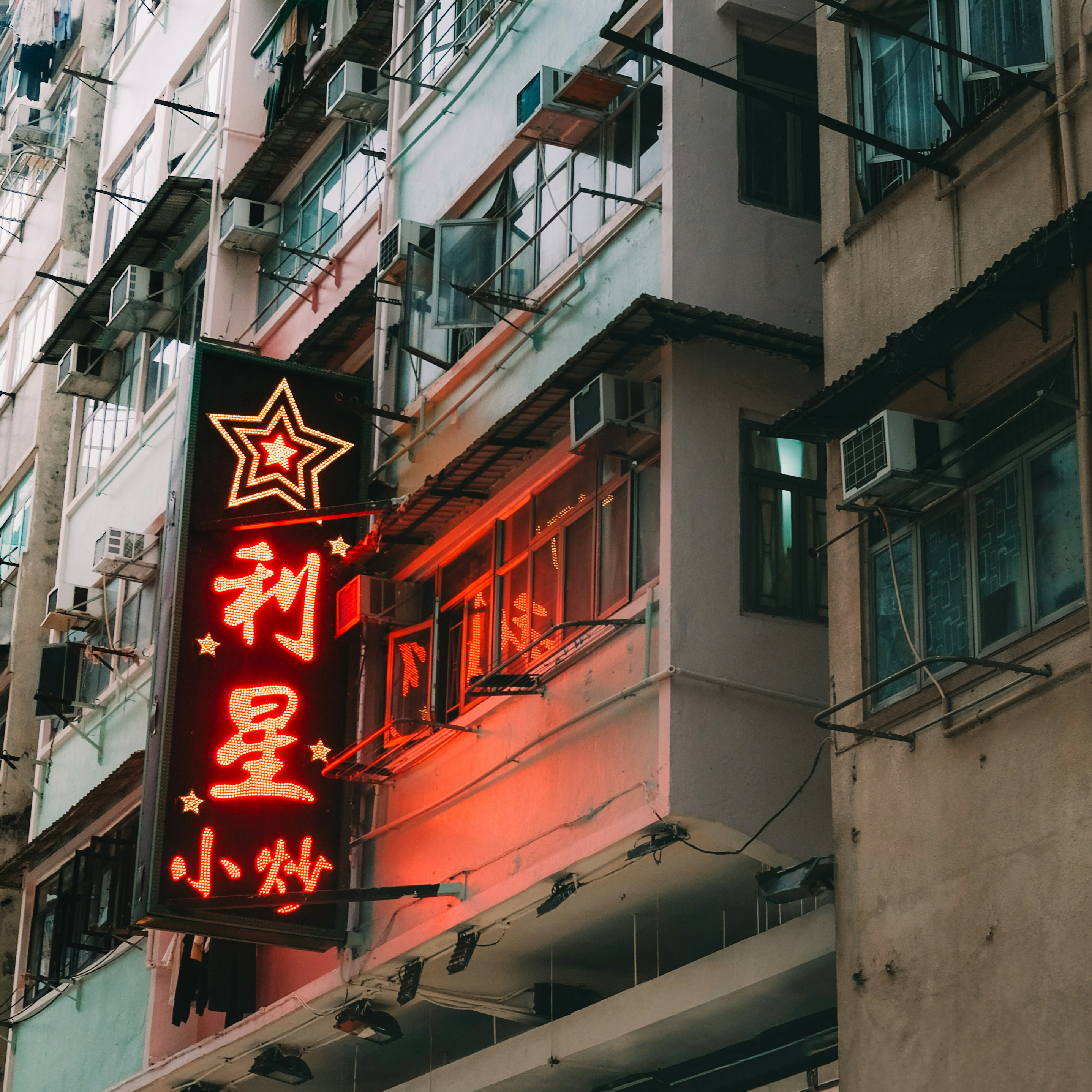 Neon Star and Signboard Echoes of an Urban Night