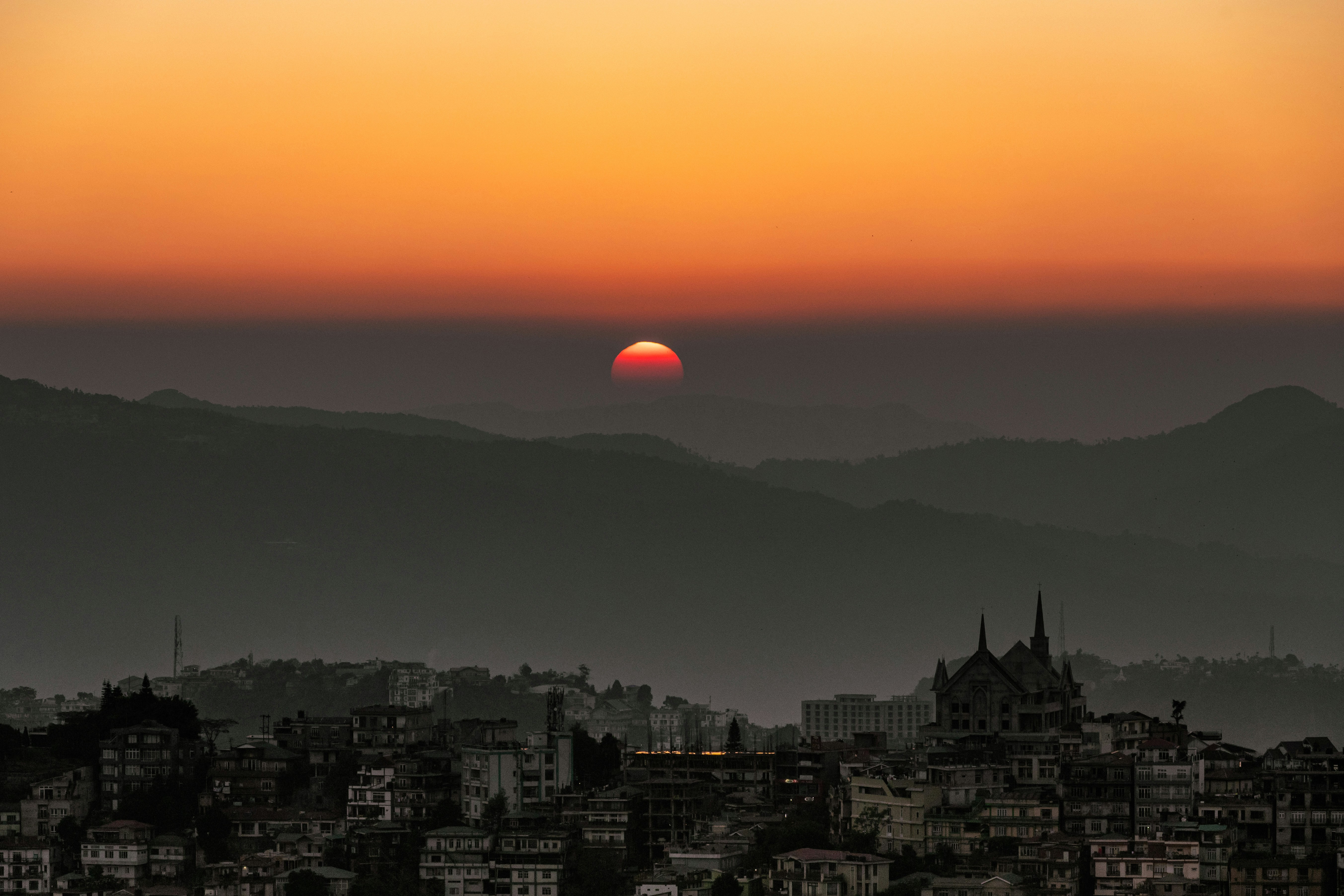 Sunset Sentinel Over the City: A Quiet Horizon