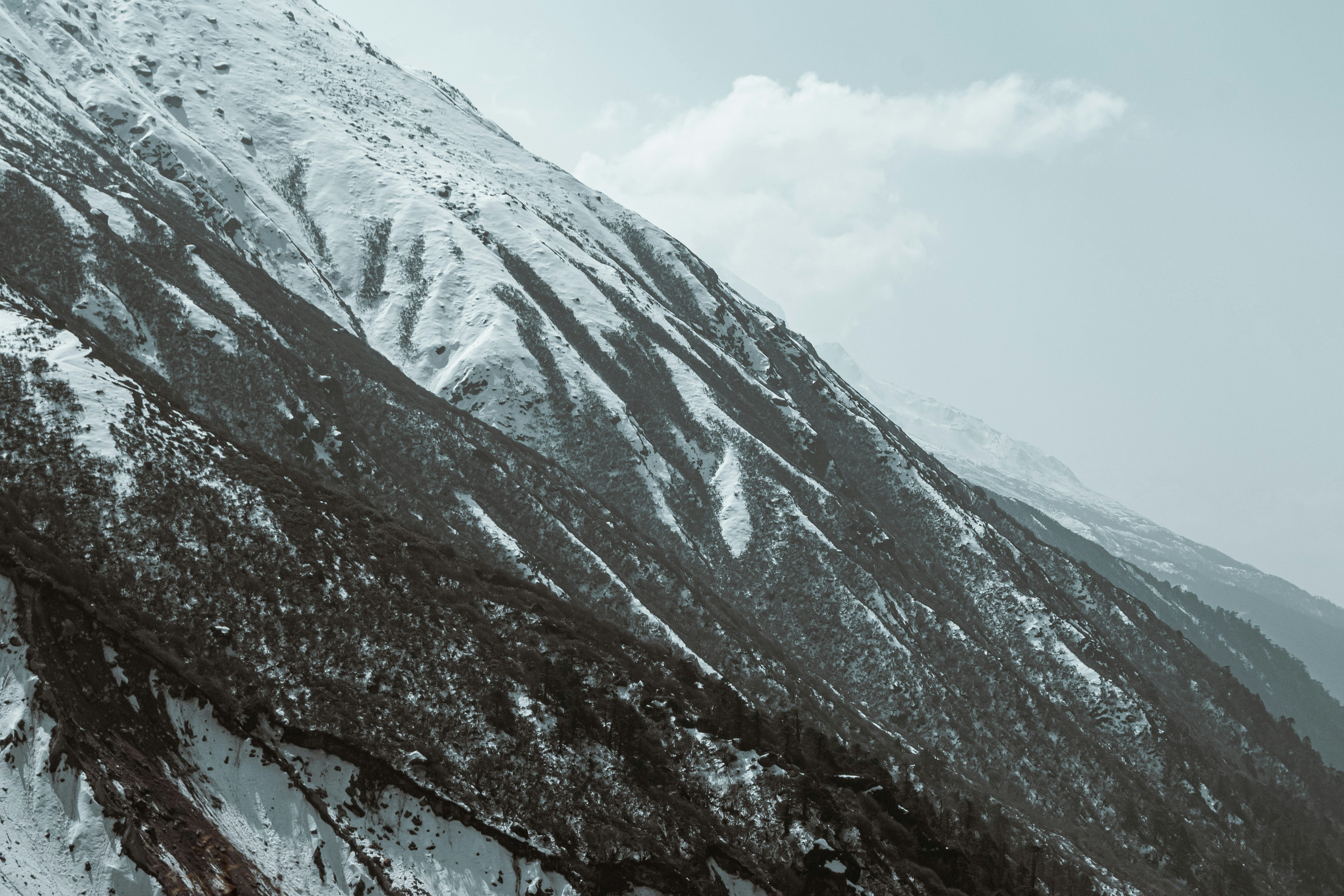 Snow-veiled Ridge under a Quiet Sky