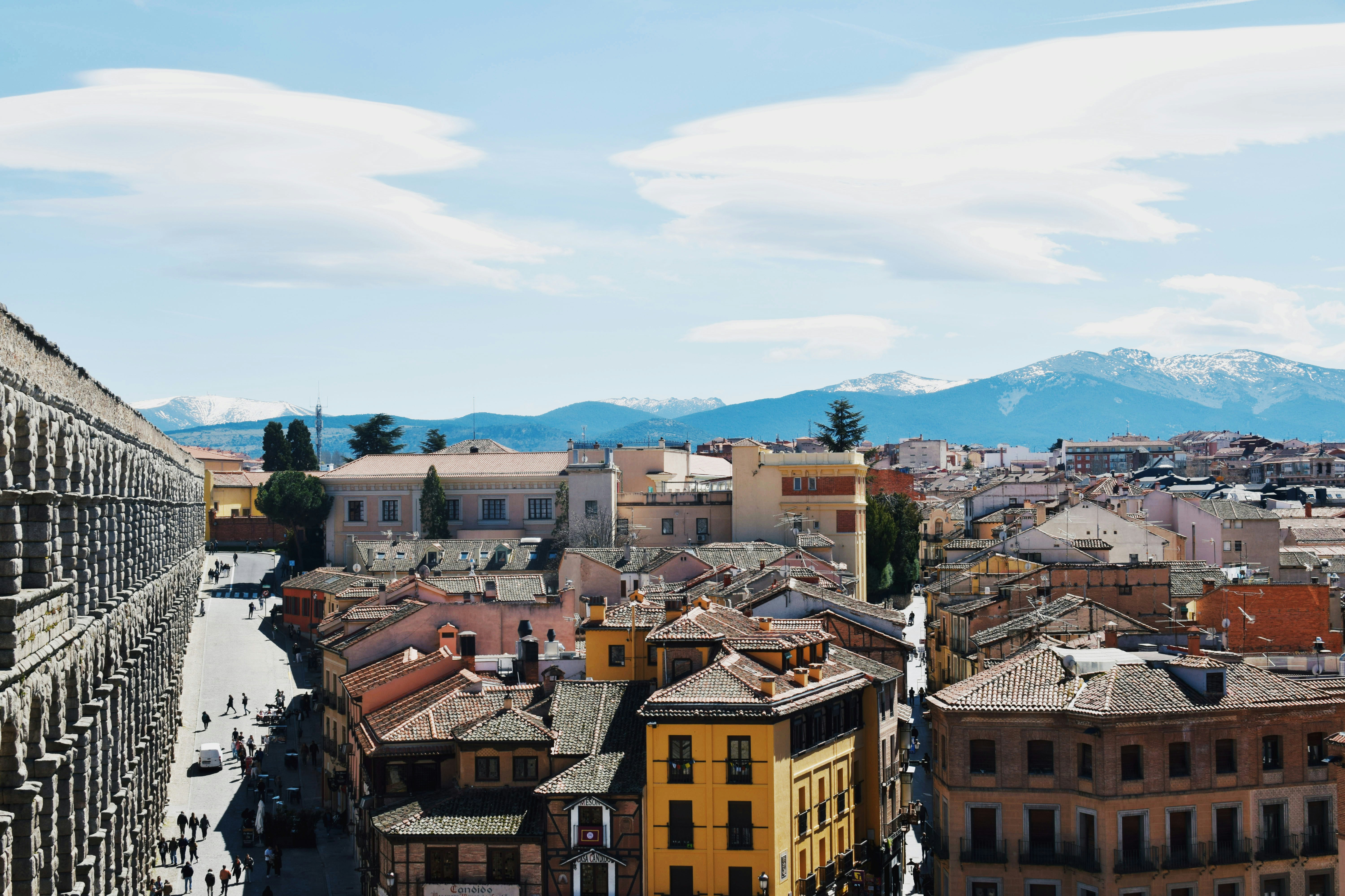 Sunlit Cortona: A Patchwork of Terracotta Rooftops with Alpine Backdrop