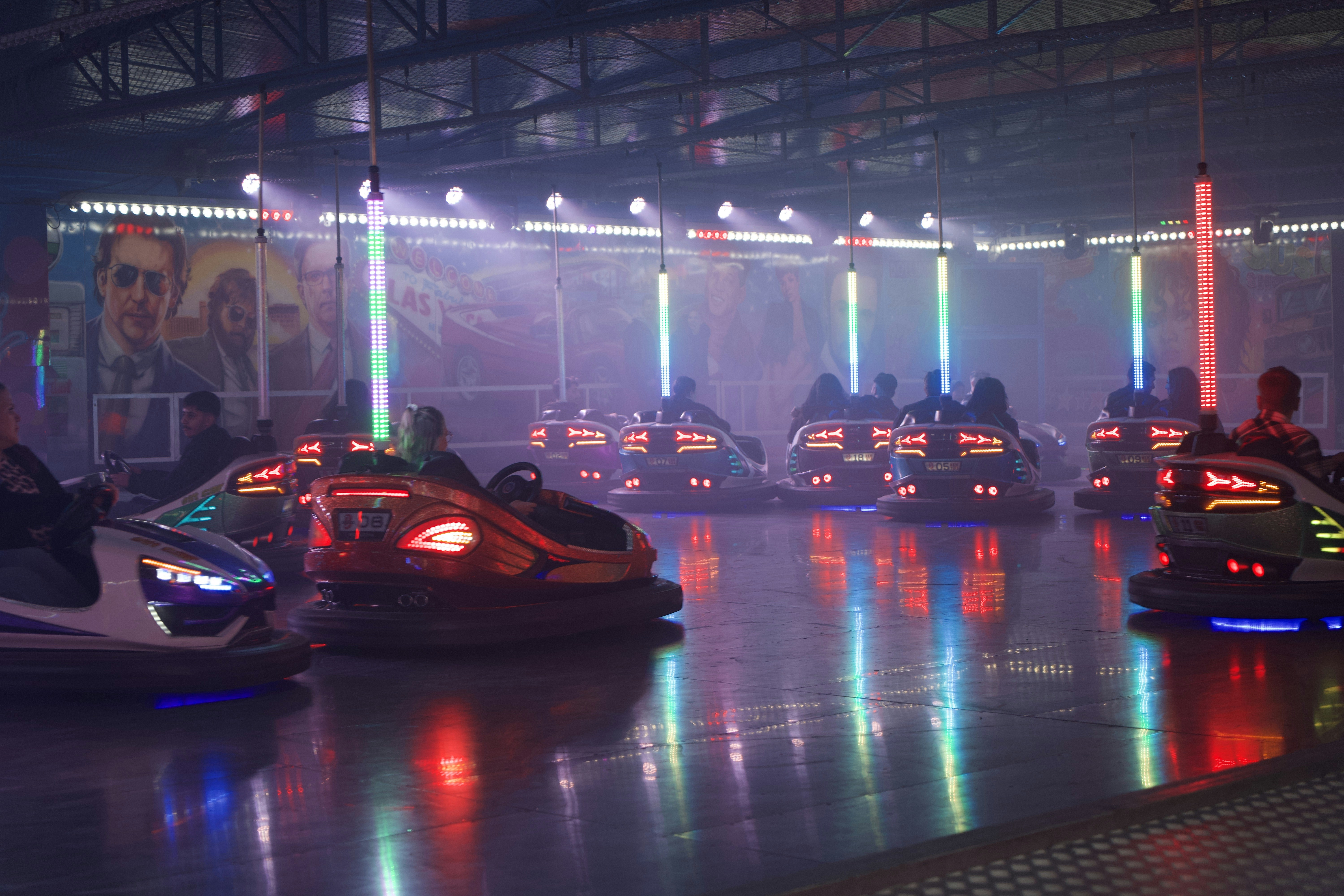 Neon Bumper Cars Under Electric Sky