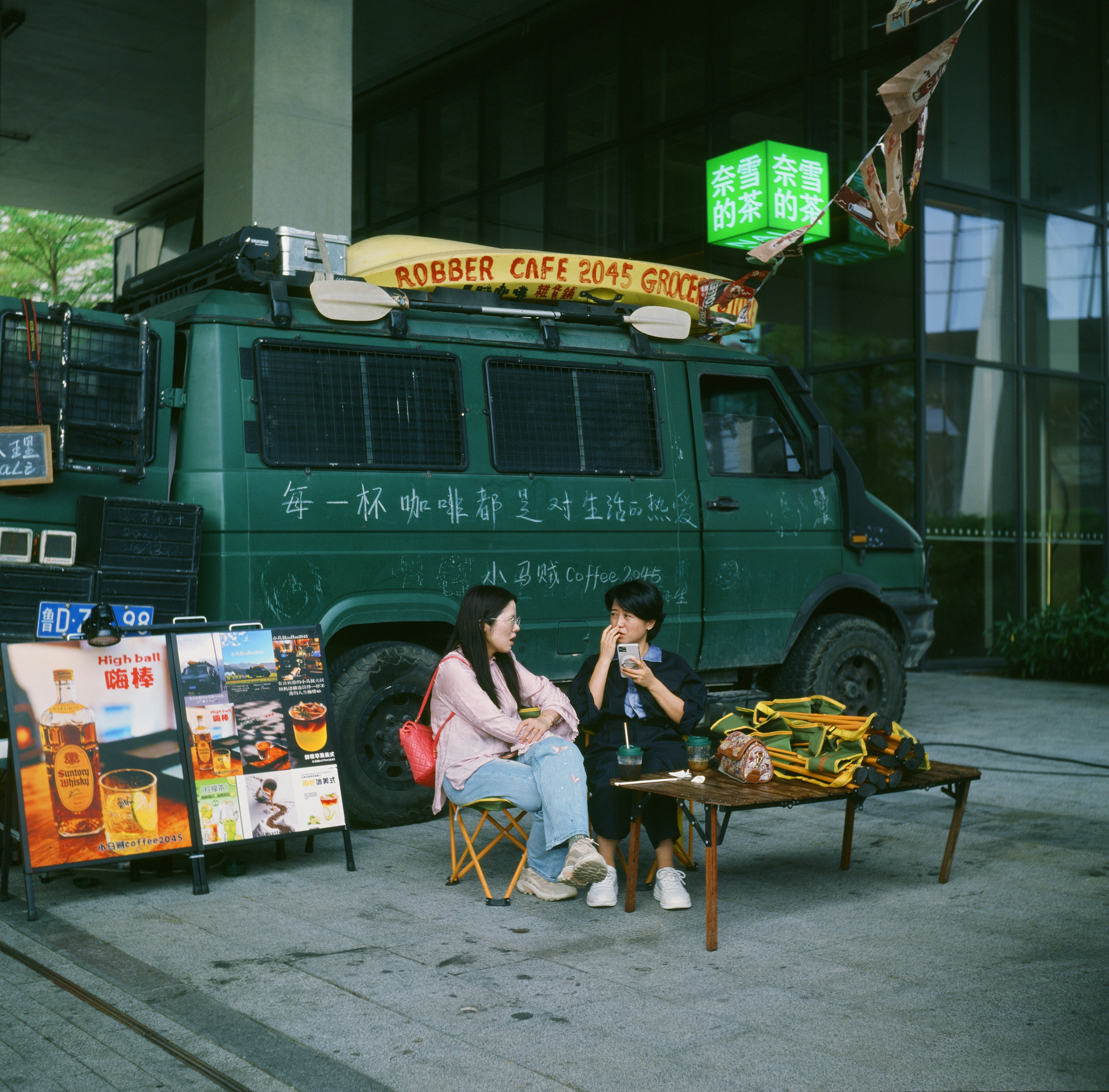 Street-side Café Between the Green Van and Friends