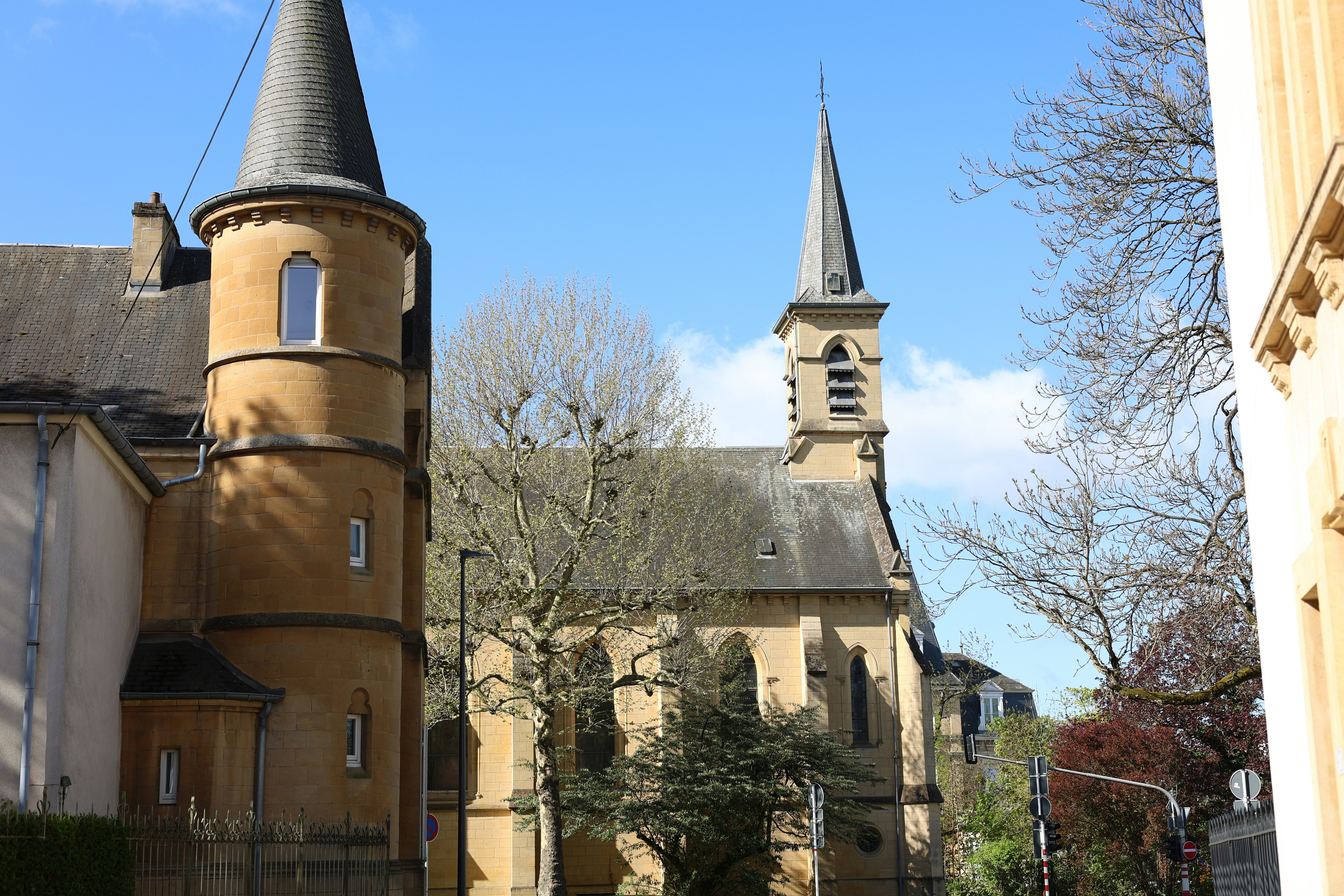 Towered Chapel Faces the Sunlit Courtyard