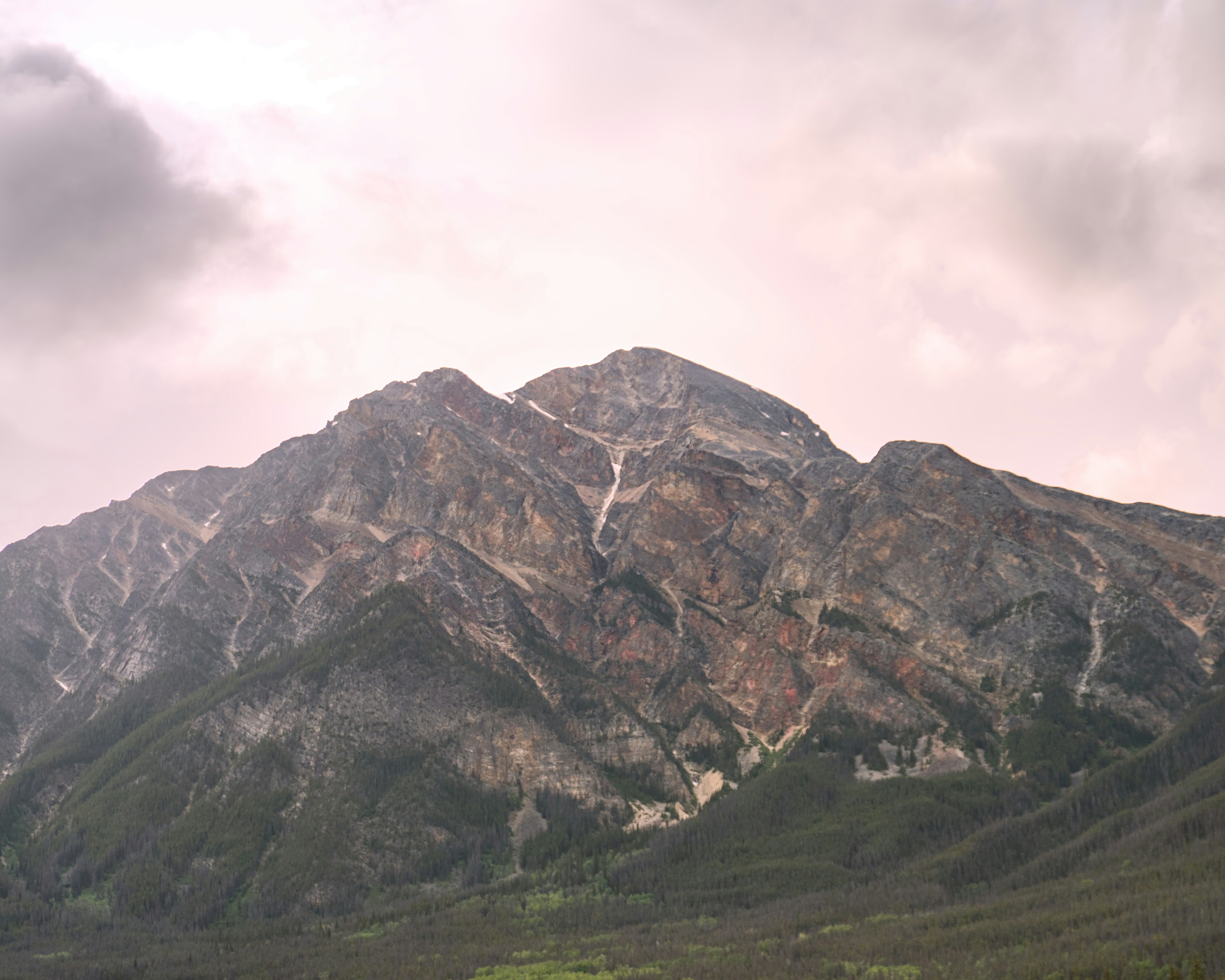 Rugged Peaks Under Soft Pink Sky