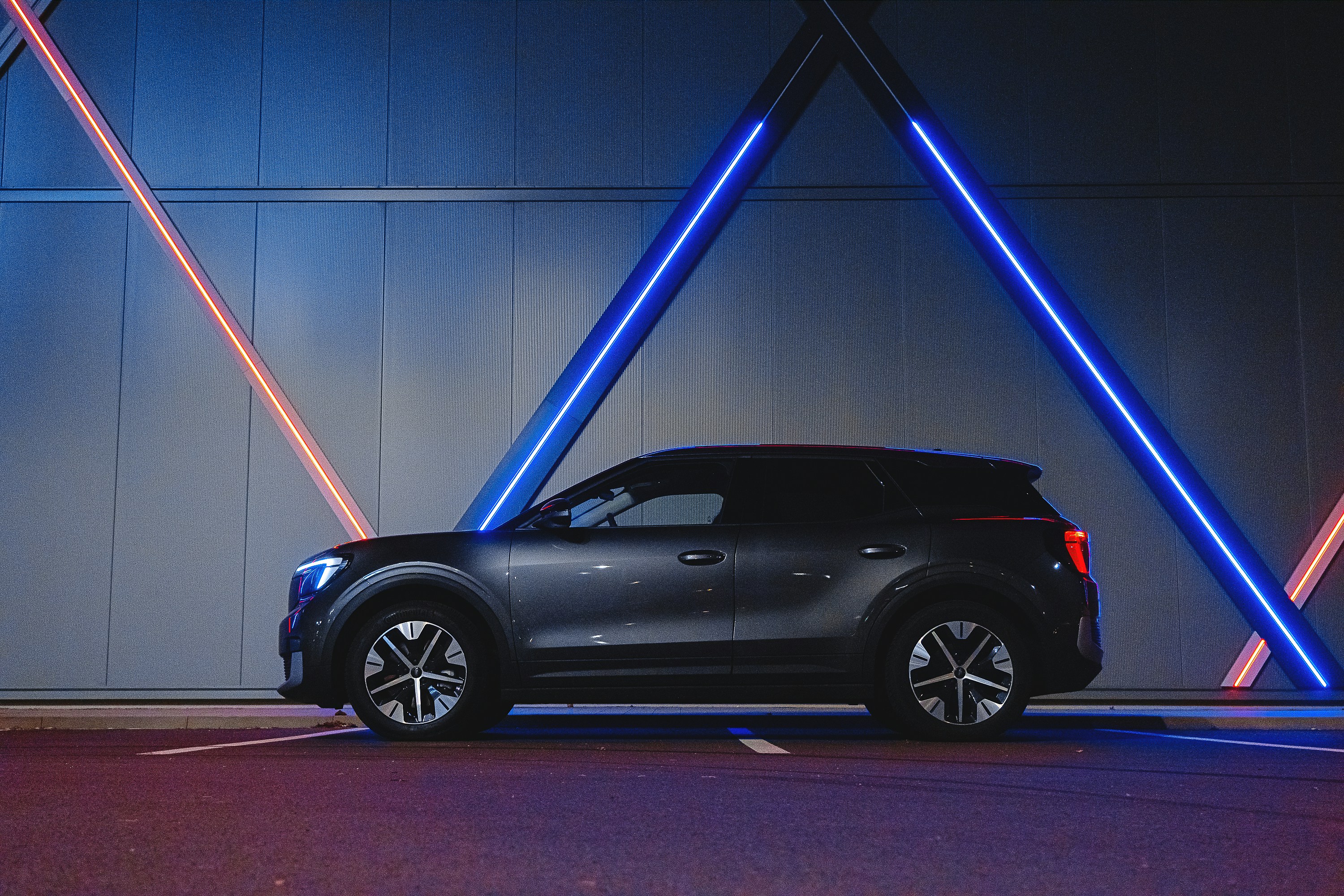 Neon-Outlined SUV Under Geometric Indigo Beams