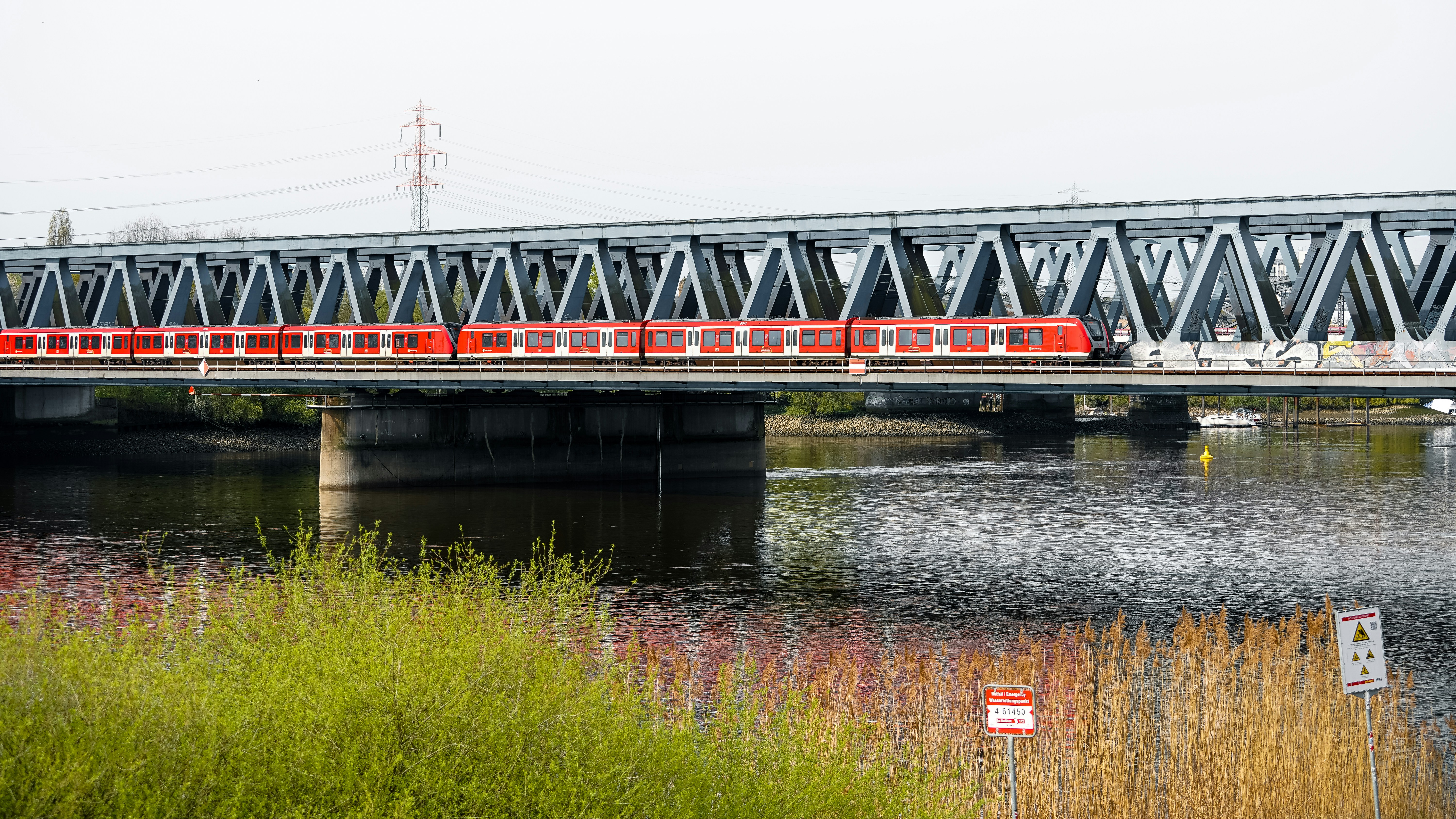 Red Line Across the River: A Train on the Steel Bridge