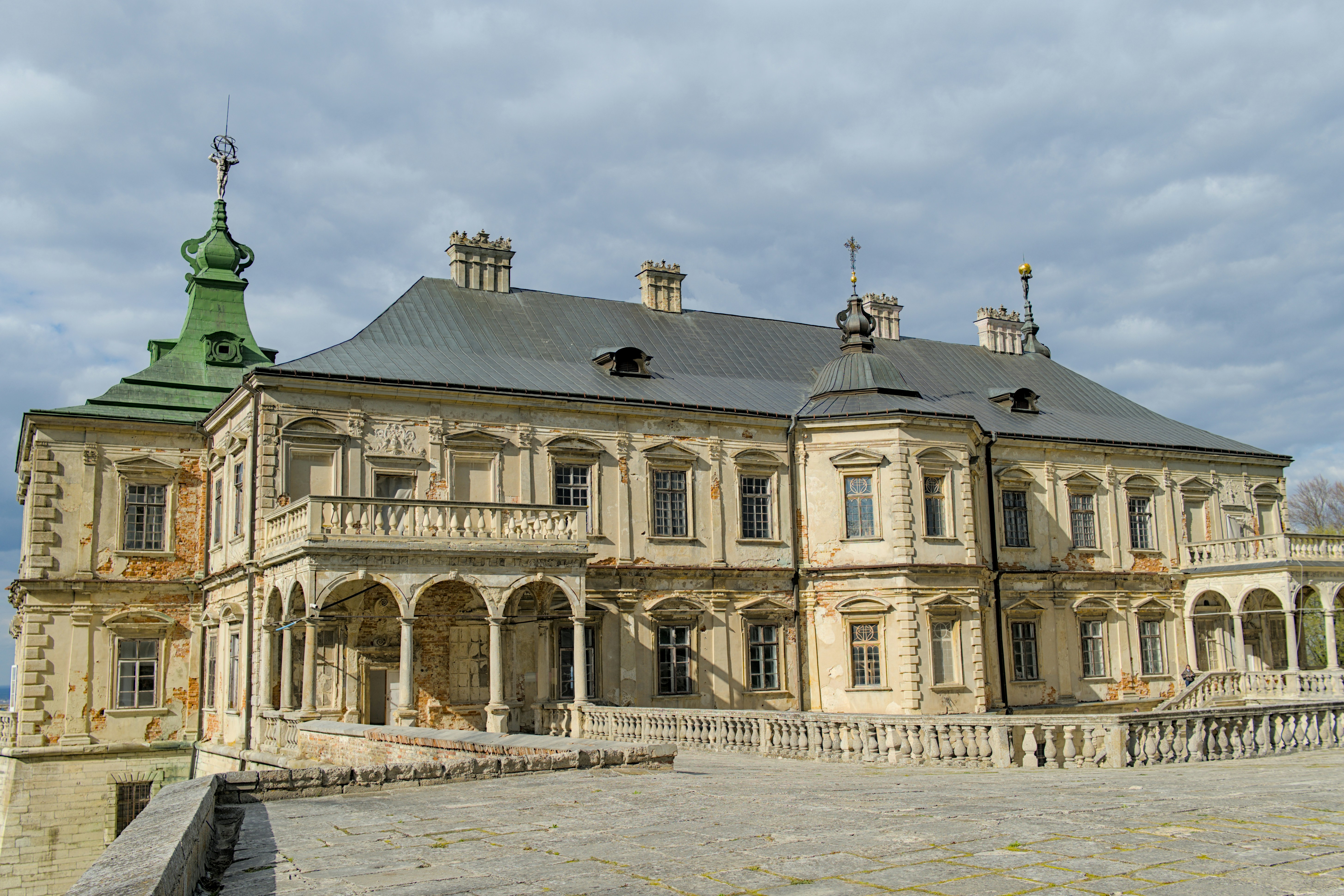 Stone Adornment: A Baroque Manor Rising from a Parched Plaza