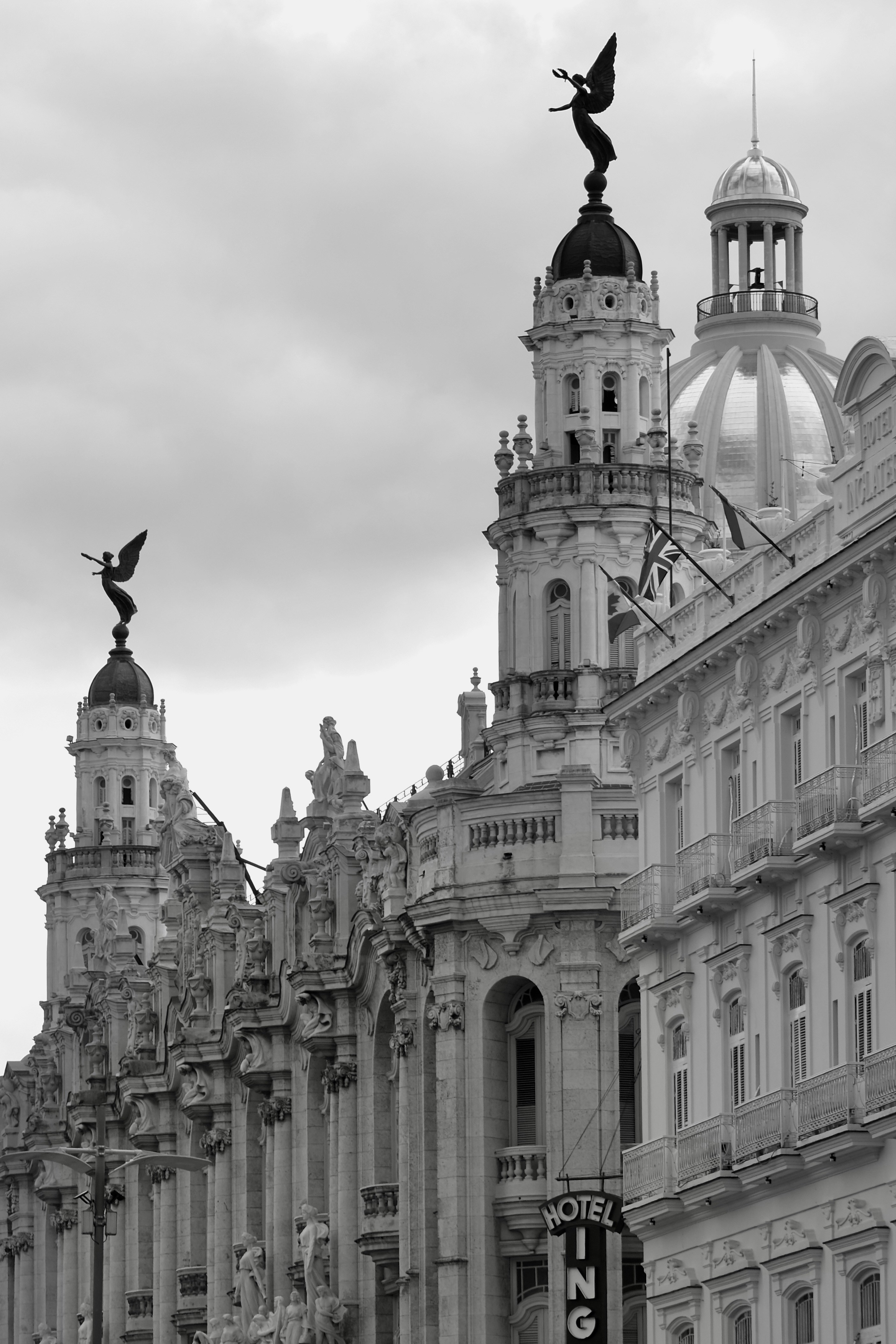 Tall Facades and Winged Statues: A Cityscape in Mono