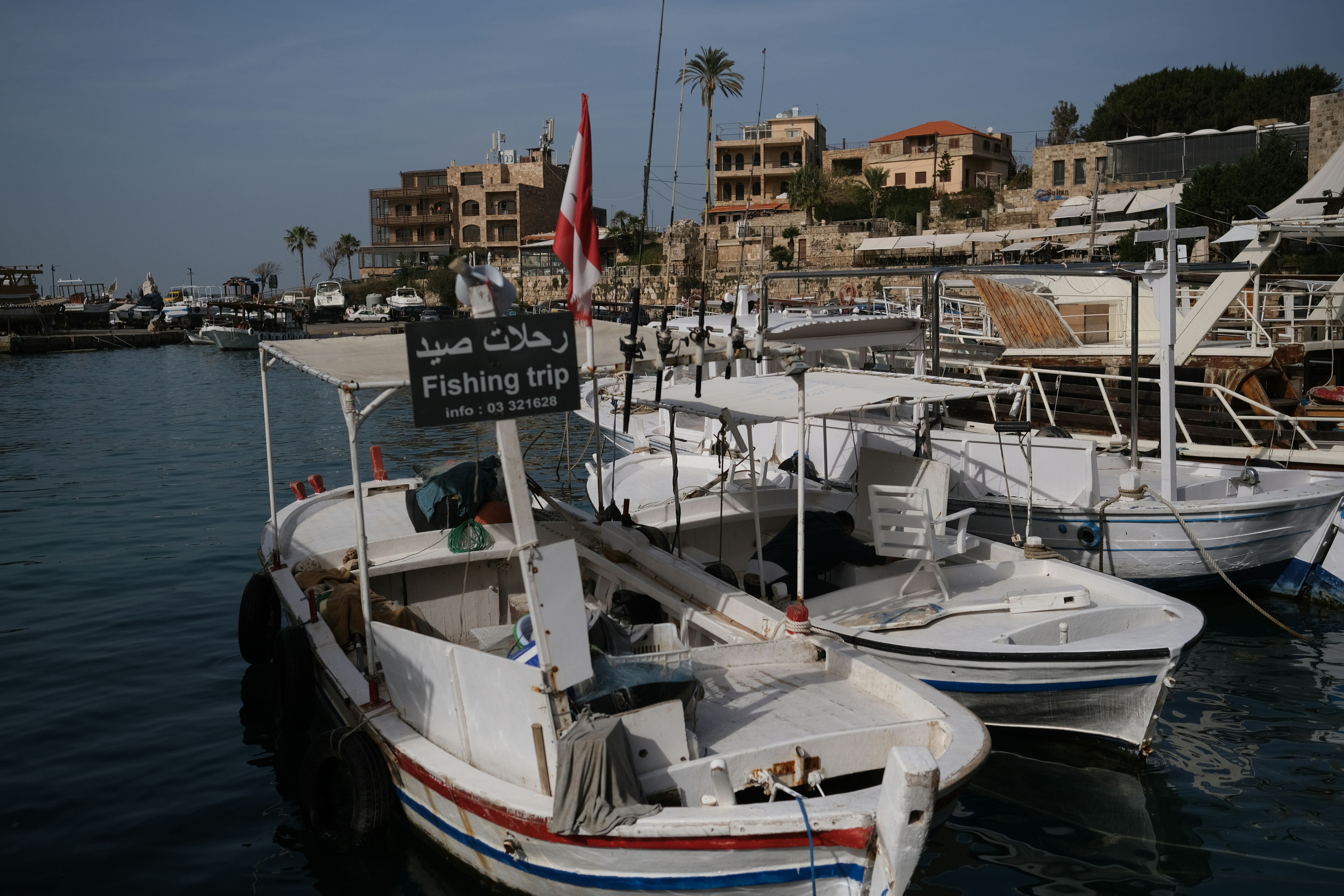 Harbor Boats at Dusk: A Close-Up of White Vessels and Quiet Tides
